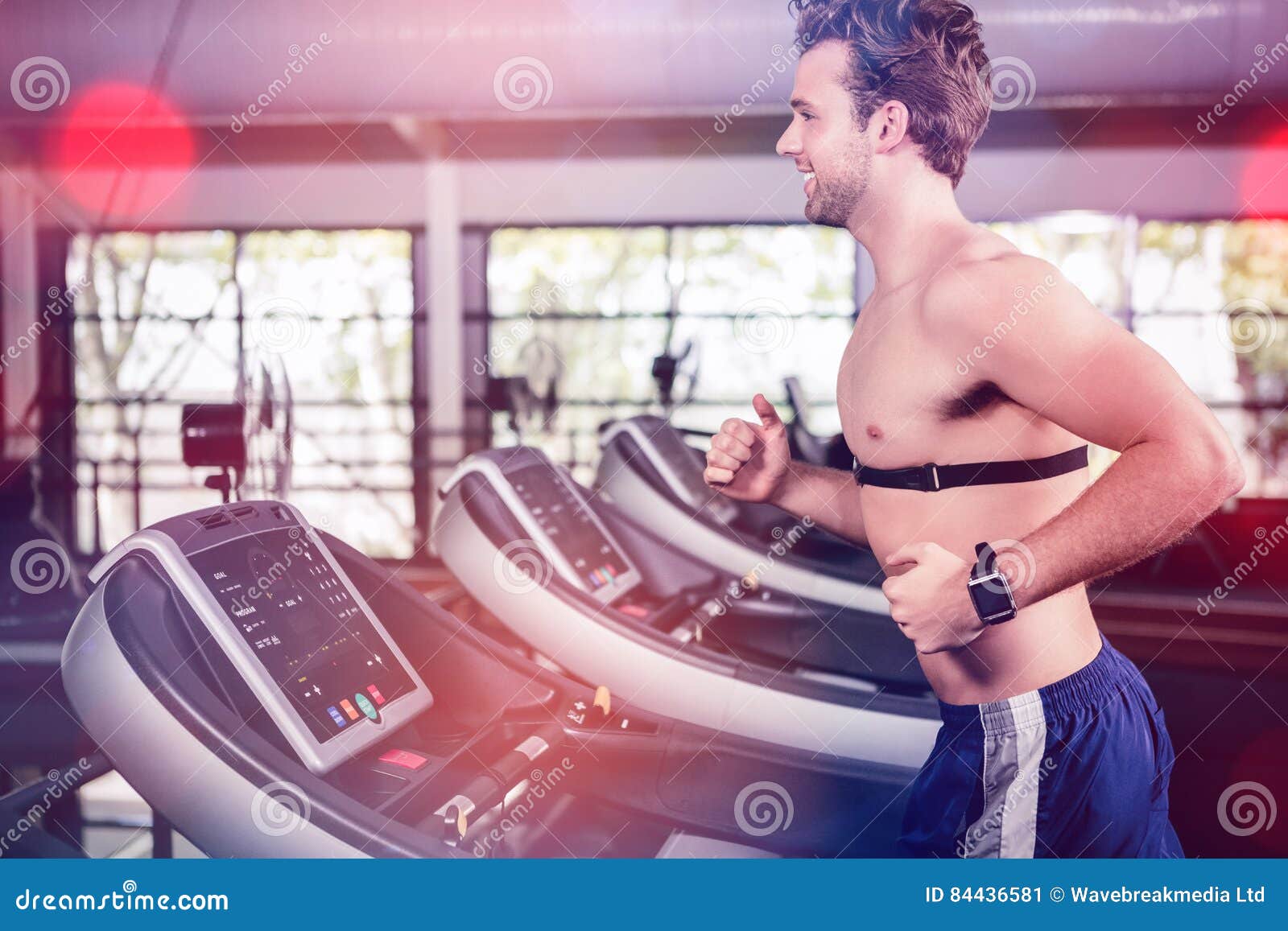 Man running on thread mill stock image. Image of athletic - 84436581