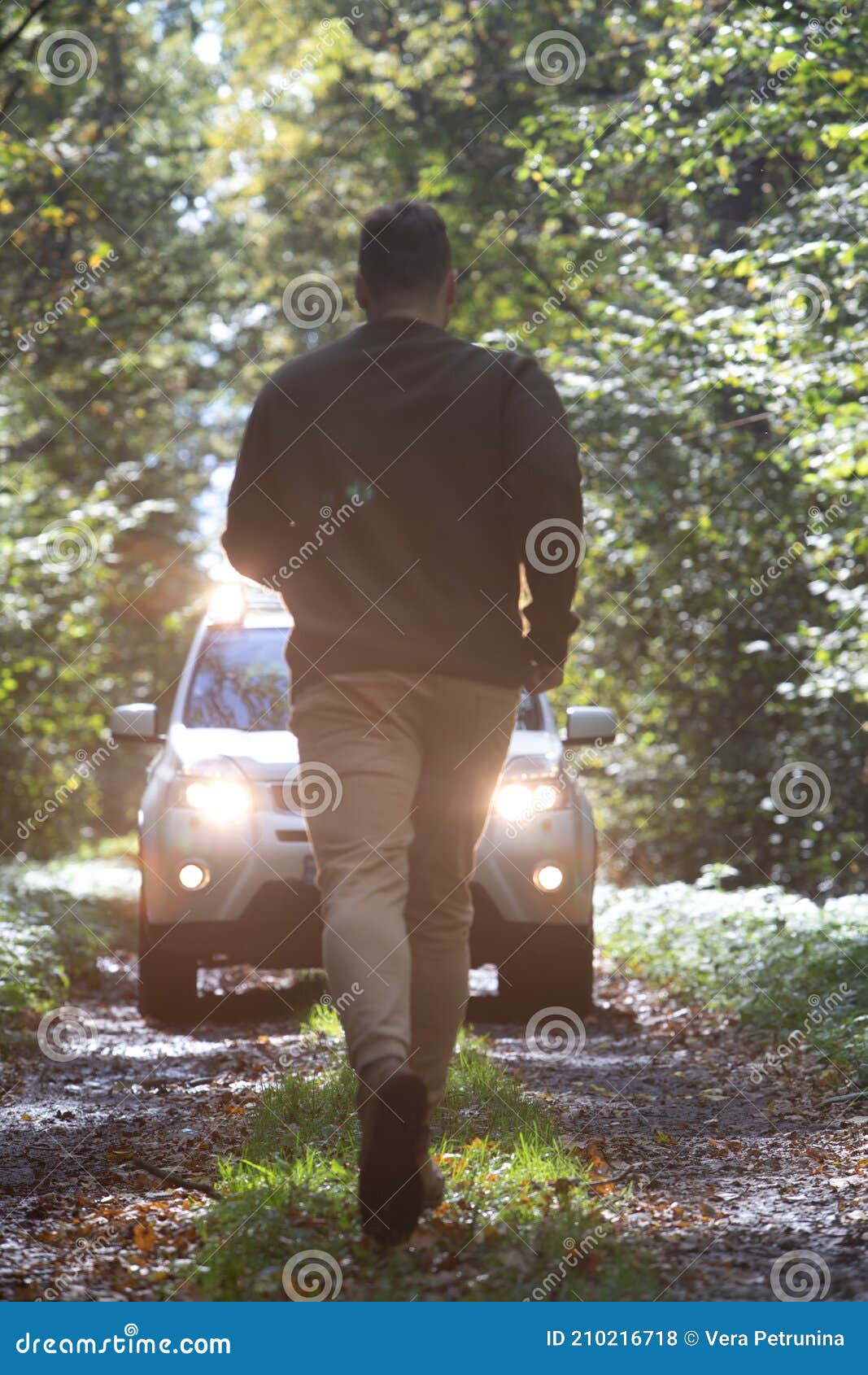 Man Running To Car Standing at the Forest Trail with Headlights on ...