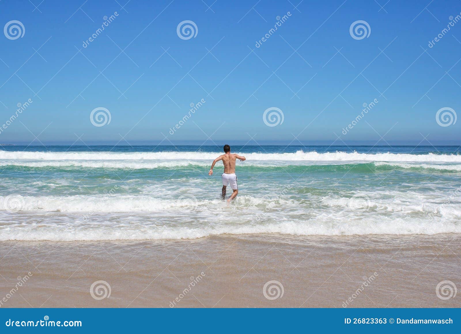 Man running in to water stock image. Image of sand, active - 26823363