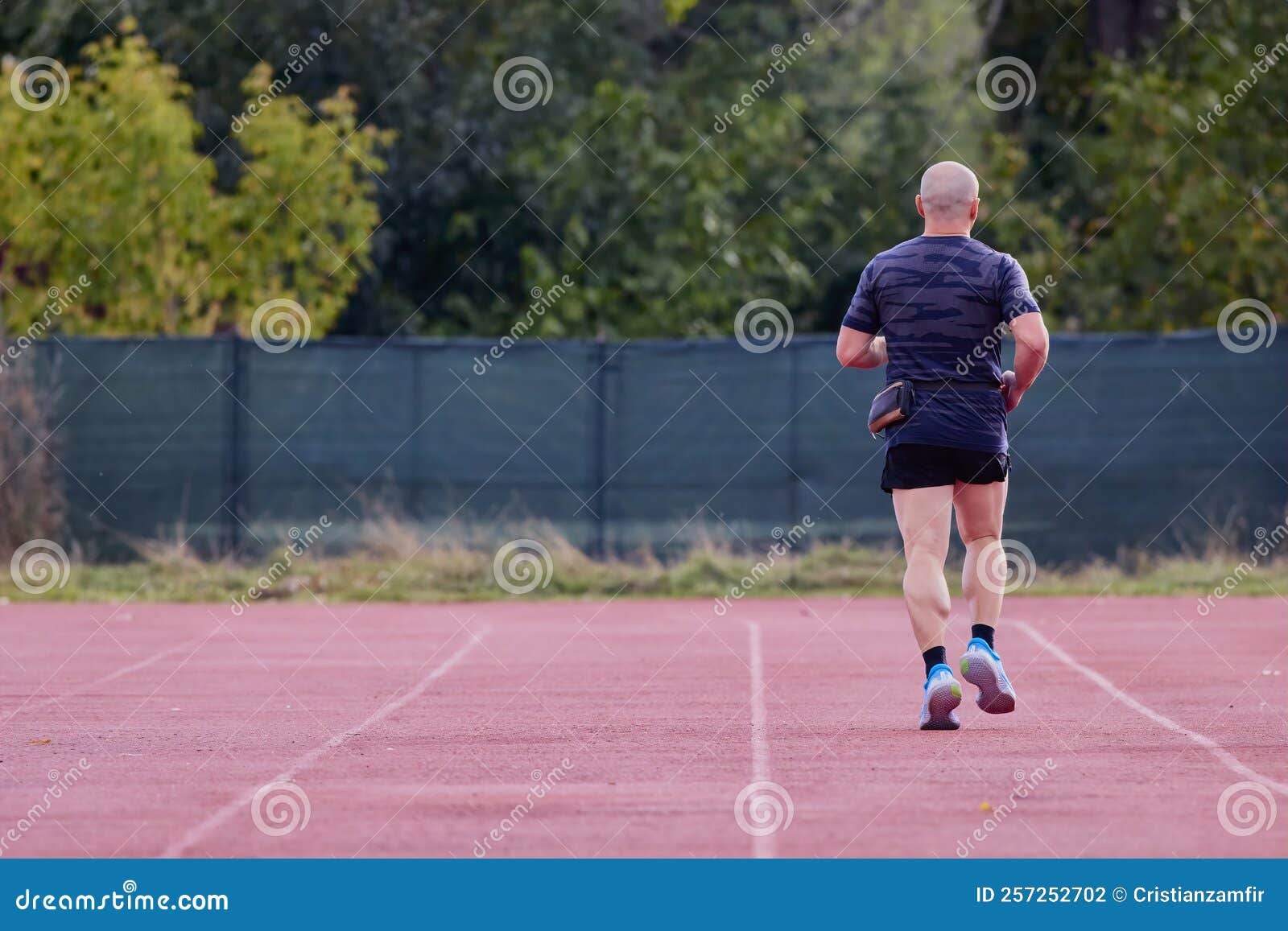 Man Running on a Running Track Stock Photo - Image of exercise, effort ...