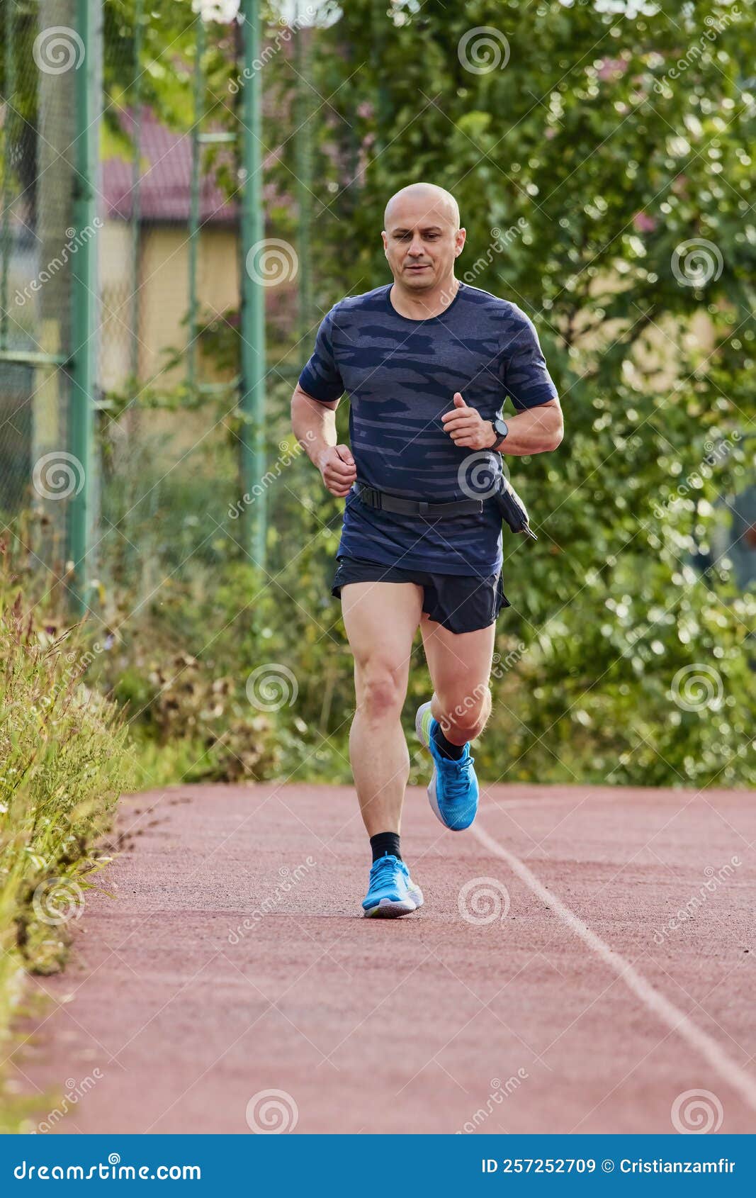 Man Running on a Running Track Stock Image - Image of active, male ...