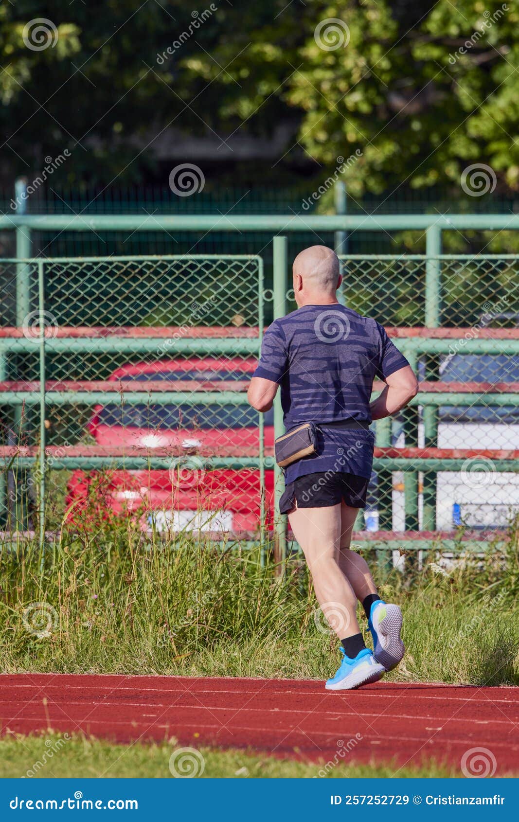 Man Running on a Running Track Stock Image - Image of runner, stadium ...