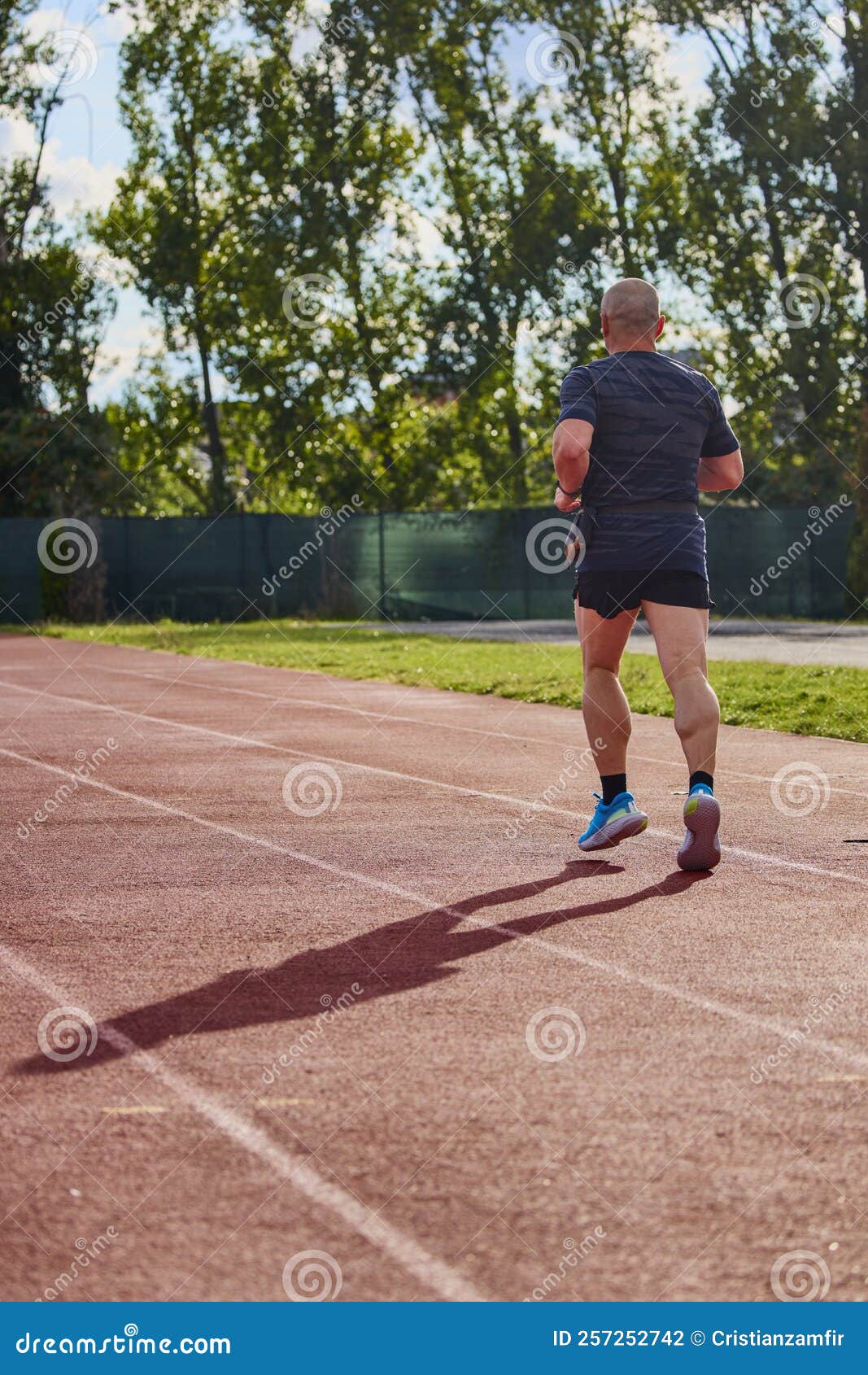 Man Running on a Running Track Stock Photo - Image of modern, endurance ...