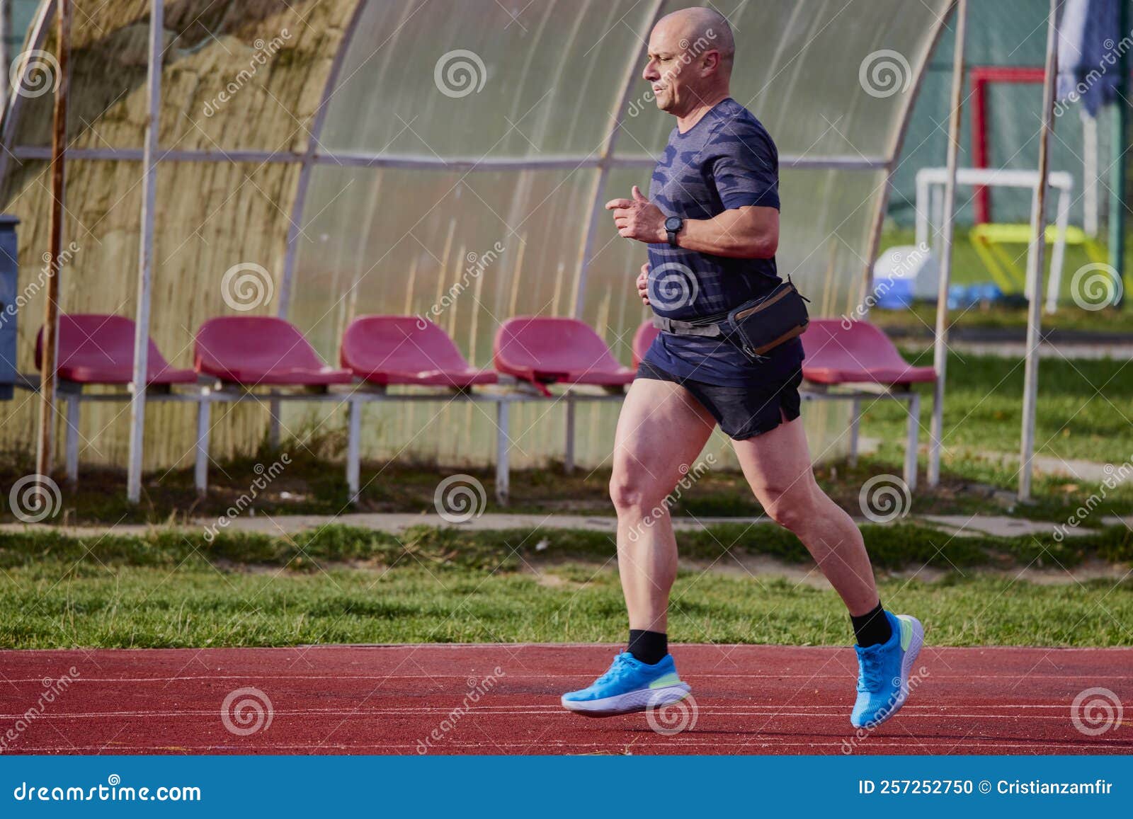 Man Running on a Running Track Stock Photo - Image of sportswear ...