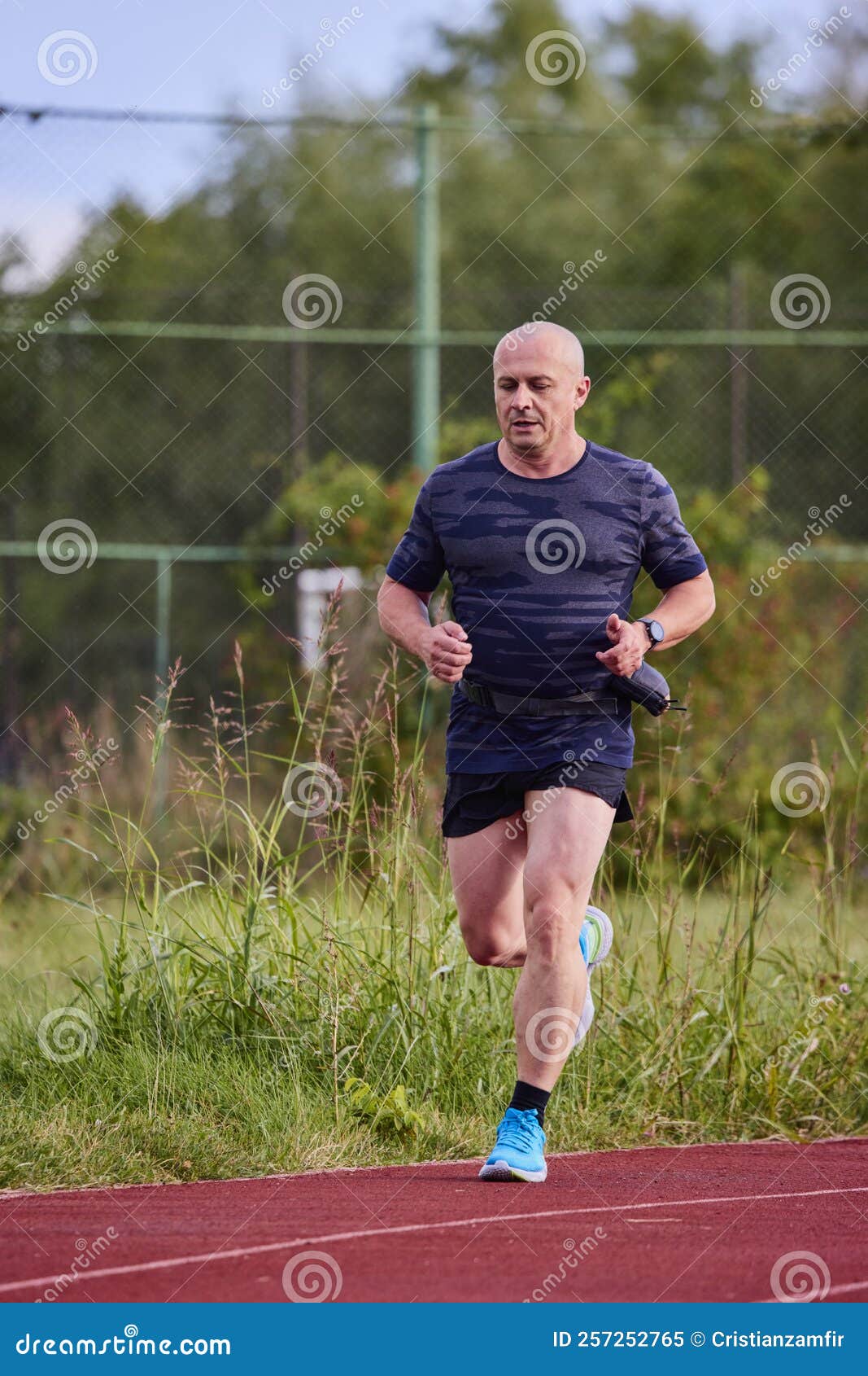 Man Running on a Running Track Stock Image - Image of stadium, training ...