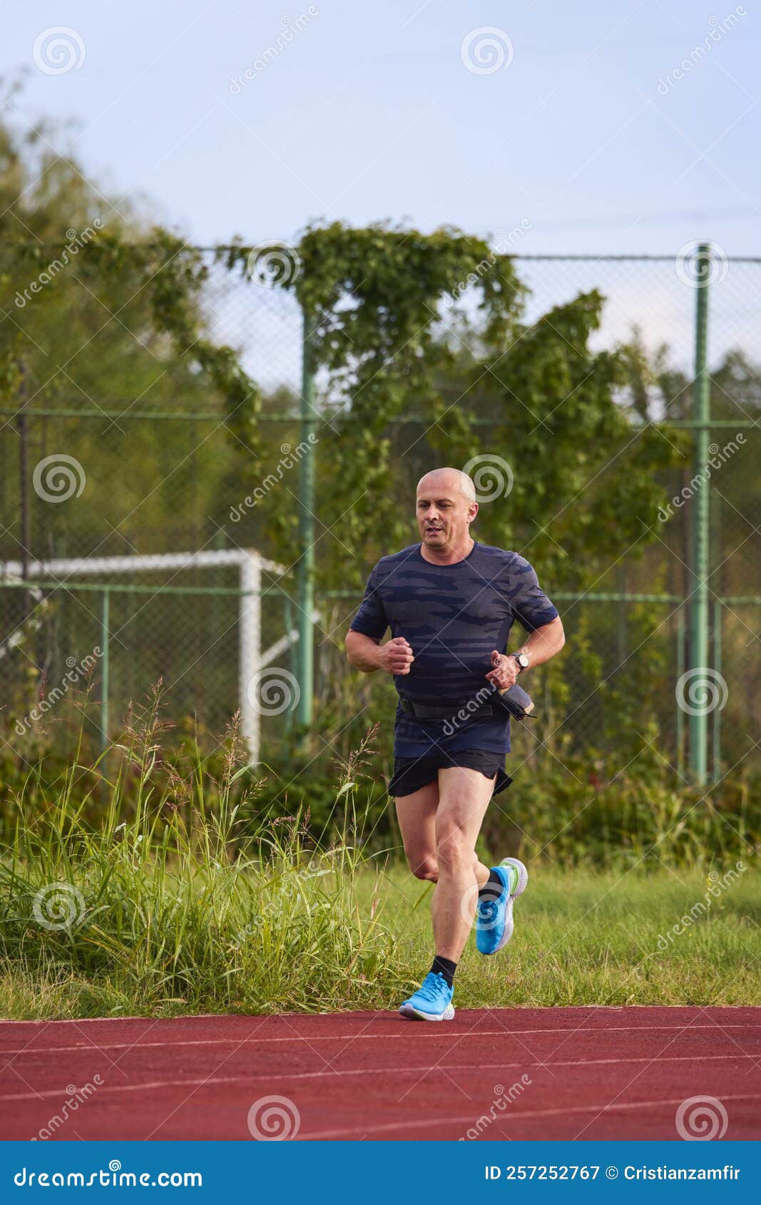 Man Running on a Running Track Stock Image - Image of lifestyle, people ...