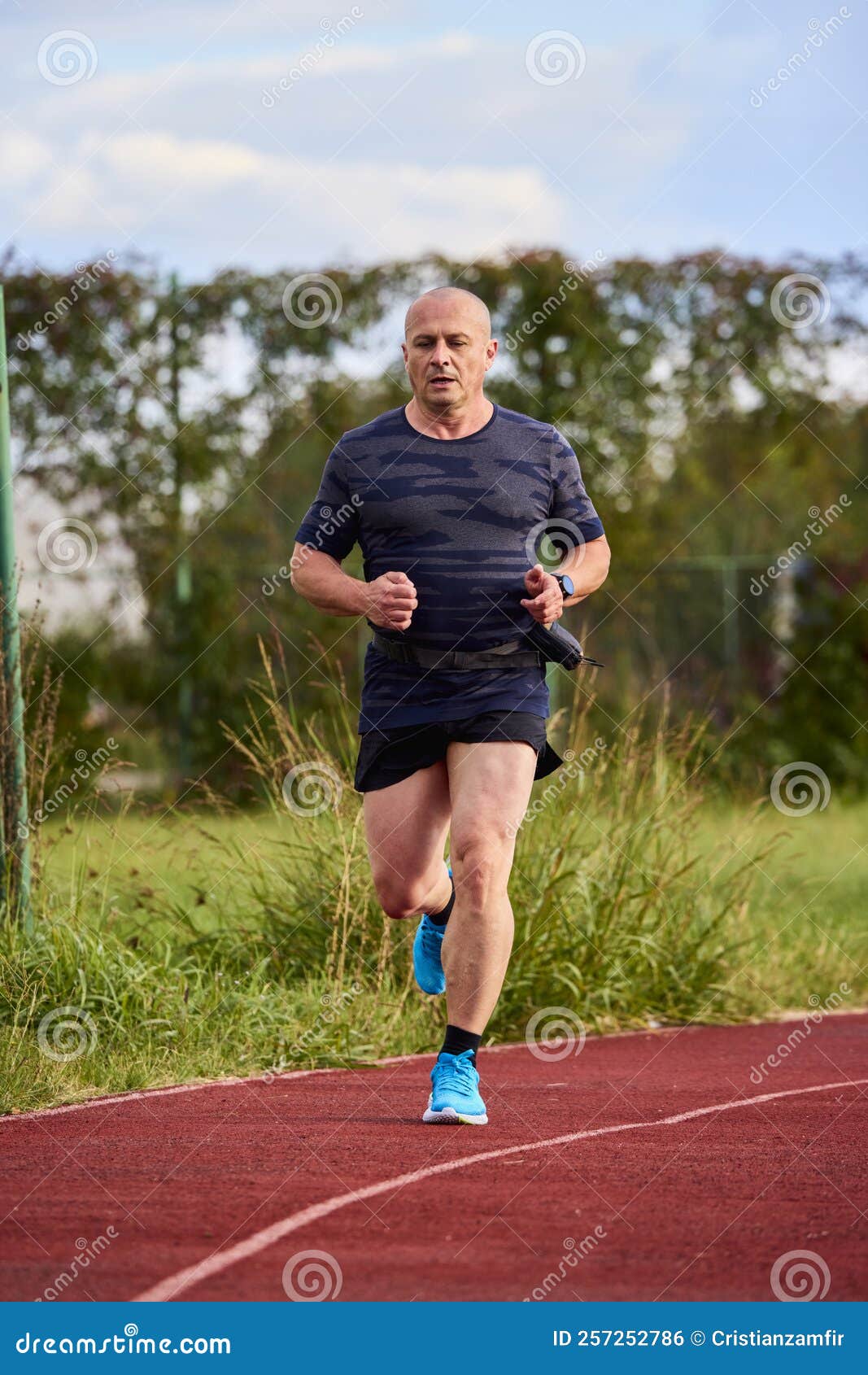 Man Running on a Running Track Stock Photo - Image of marathon, summer ...
