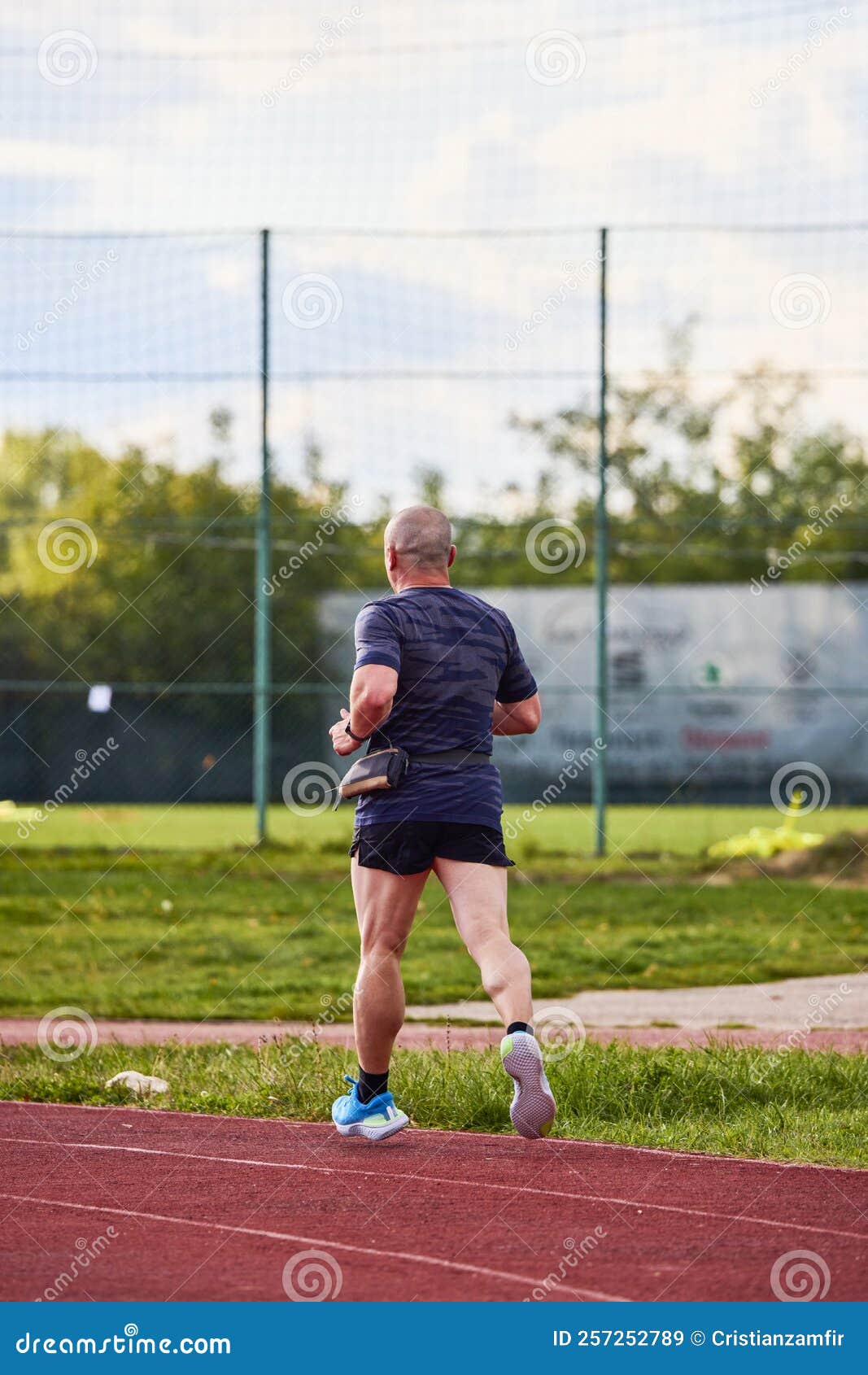 Man Running on a Running Track Stock Image - Image of activity, sport ...