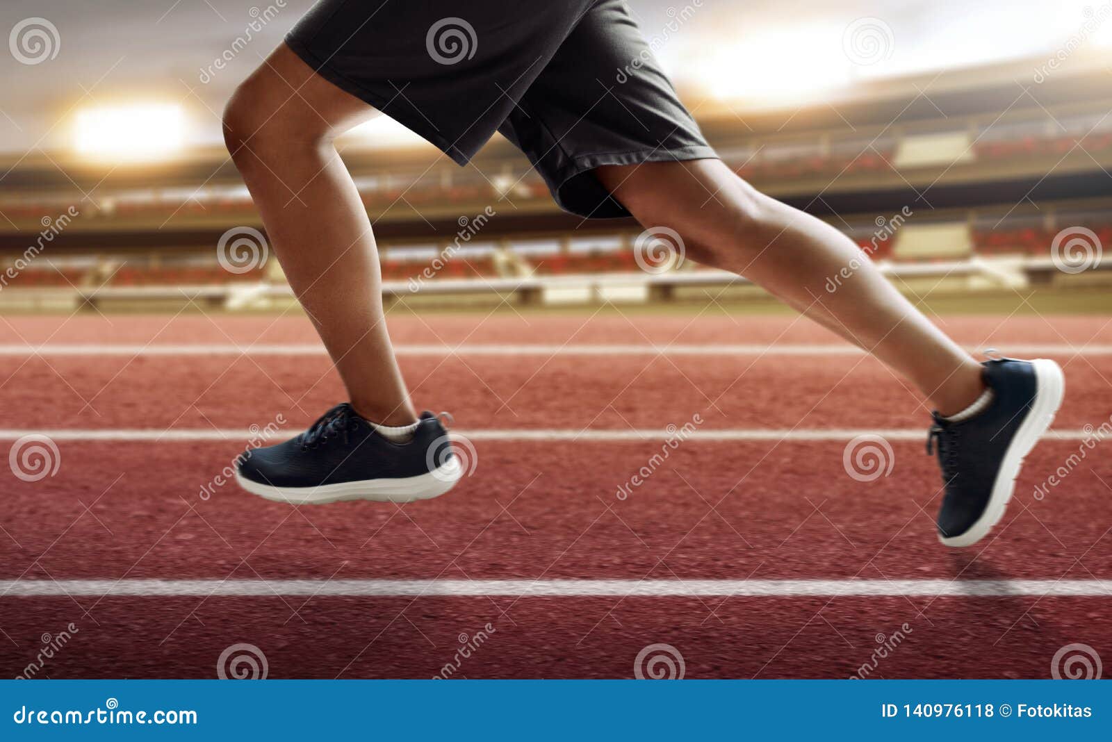 Man running on the track stock photo. Image of jogger - 140976118