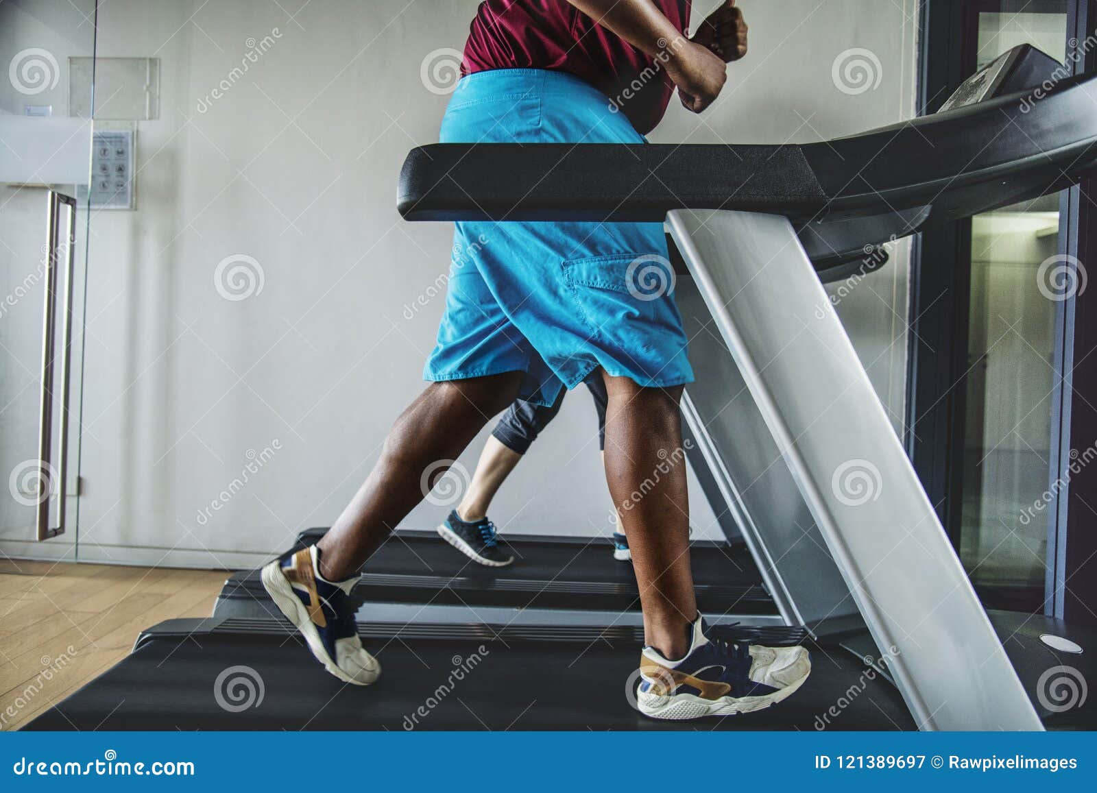 Man running on a treadmill stock image. Image of build - 121389697