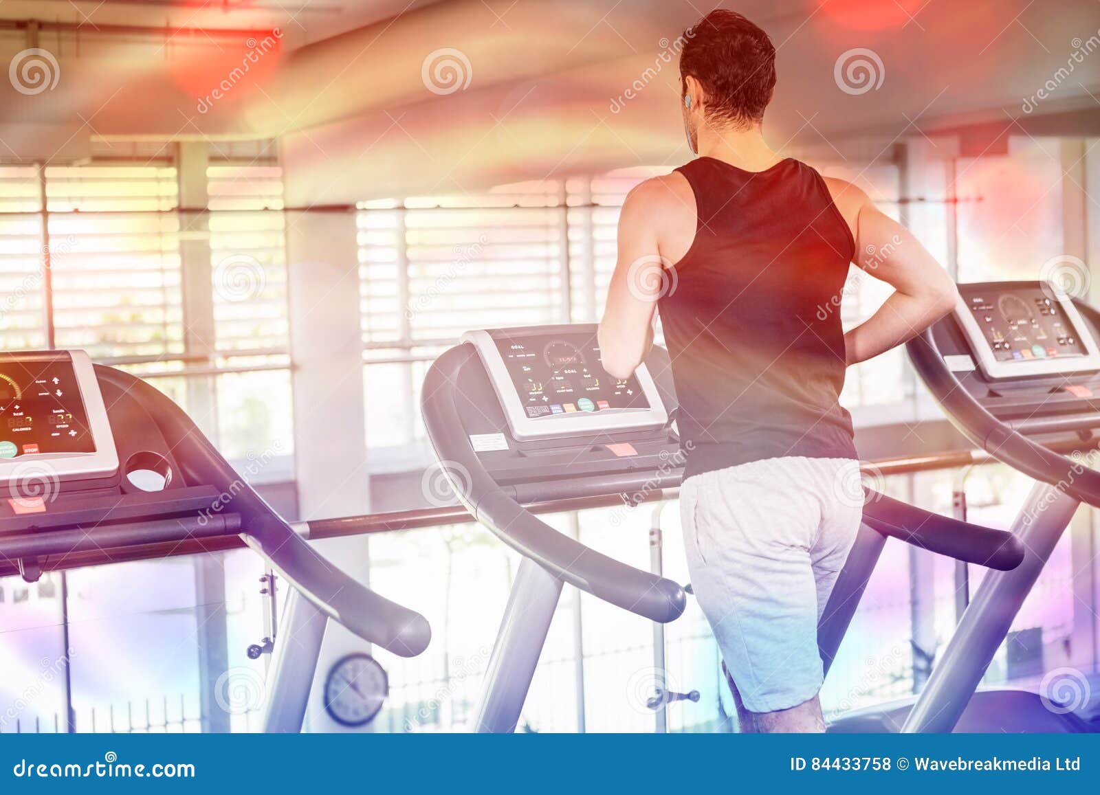 Man running on treadmill stock photo. Image of computer - 84433758