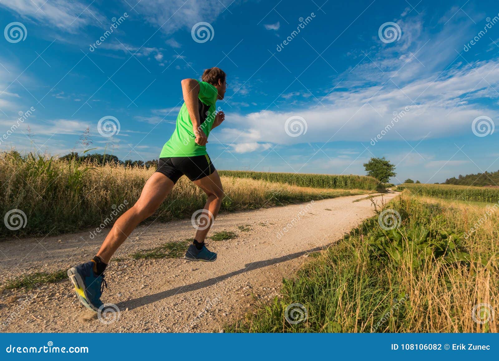 The Man Running on the Unpaved Country Road Stock Photo - Image of ...