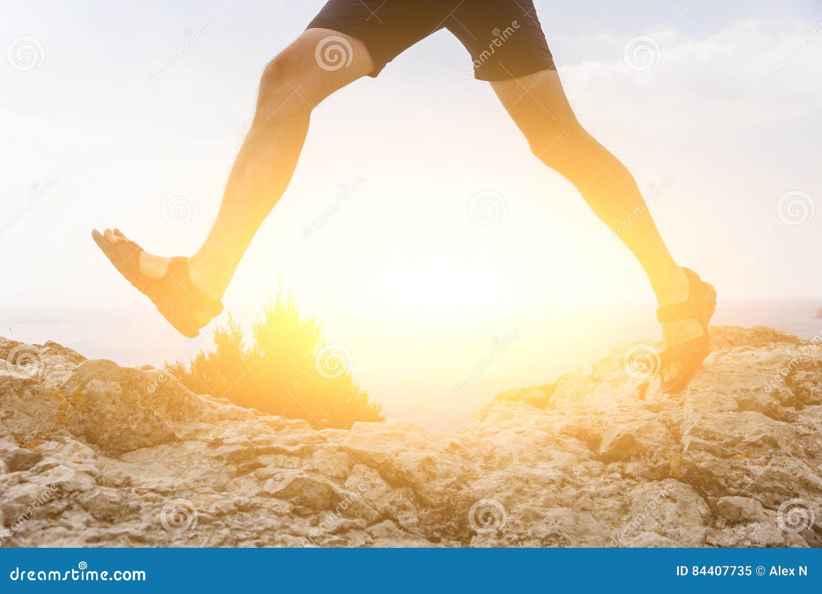 Man runs on mountain day stock image. Image of cloudy - 84407735