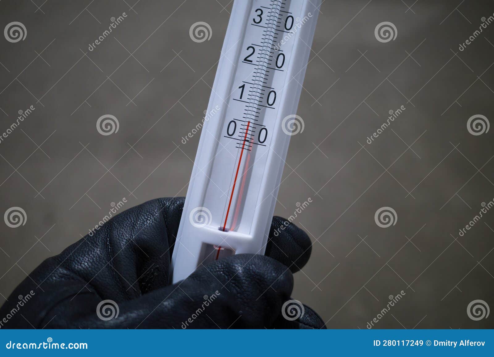 A Man S Gloved Hand Holds a Thermometer with a Low Plus Temperature in ...