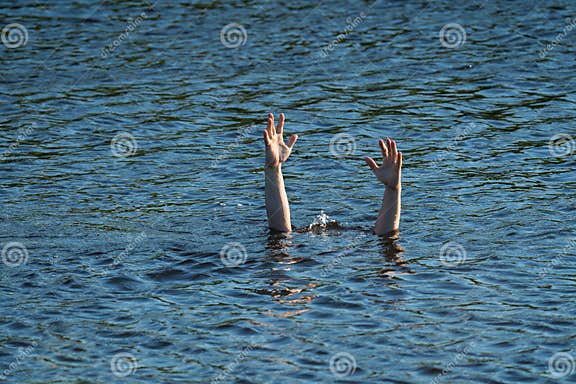 A Man`s Hand Above the Surface of the Water in the River, Saving ...