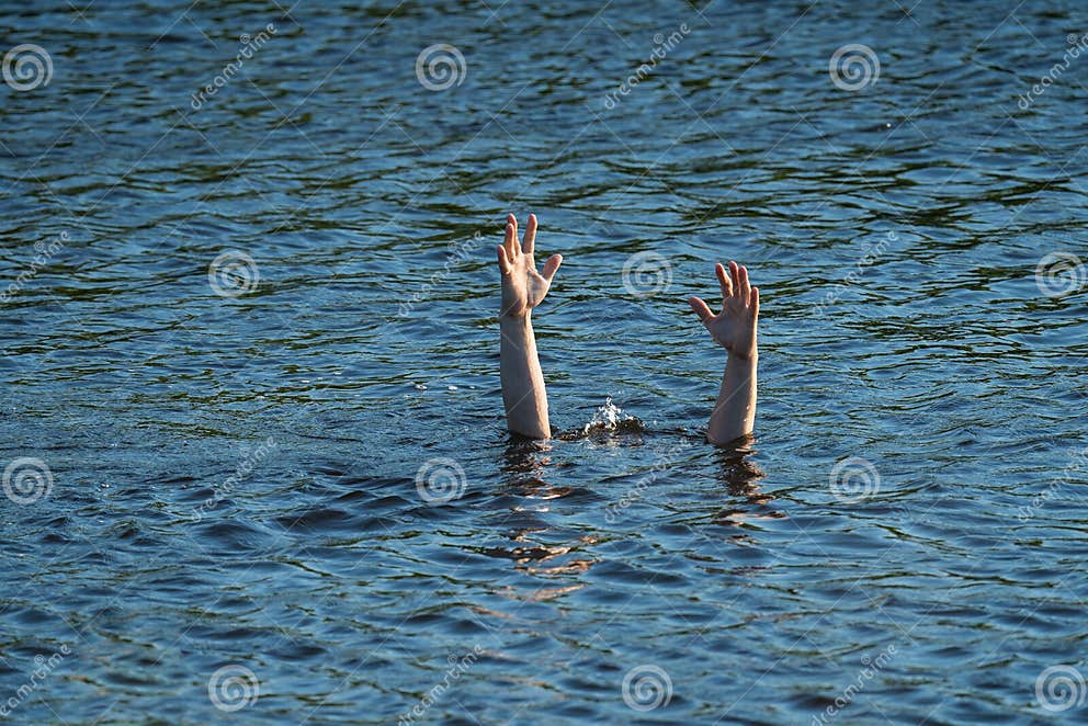 A Man`s Hand Above the Surface of the Water in the River, Saving ...