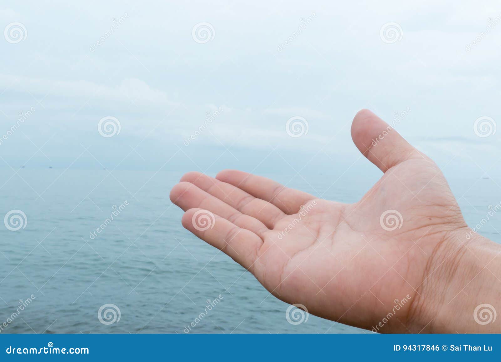 Man`s Hand on a Background of the Sea Stock Photo - Image of beauty ...