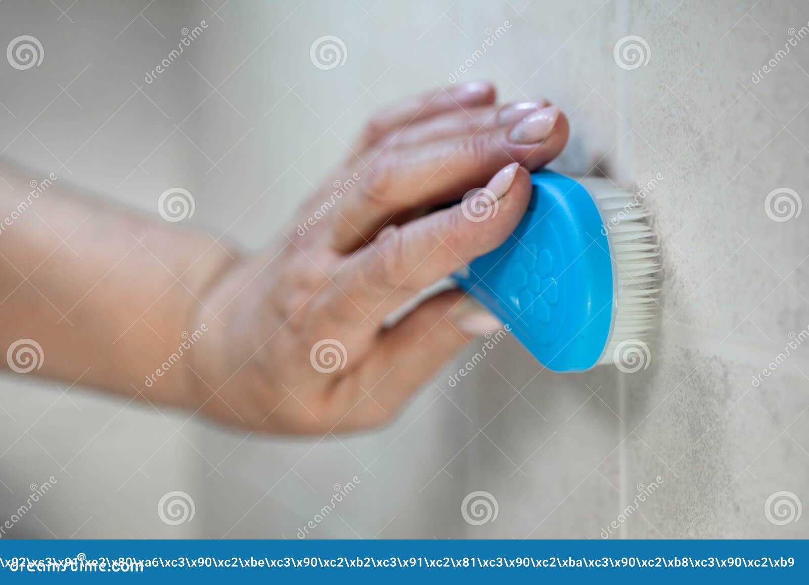 A Man& X27;s Hand Cleans a Tile Wall with a Blue Brush Stock Image ...