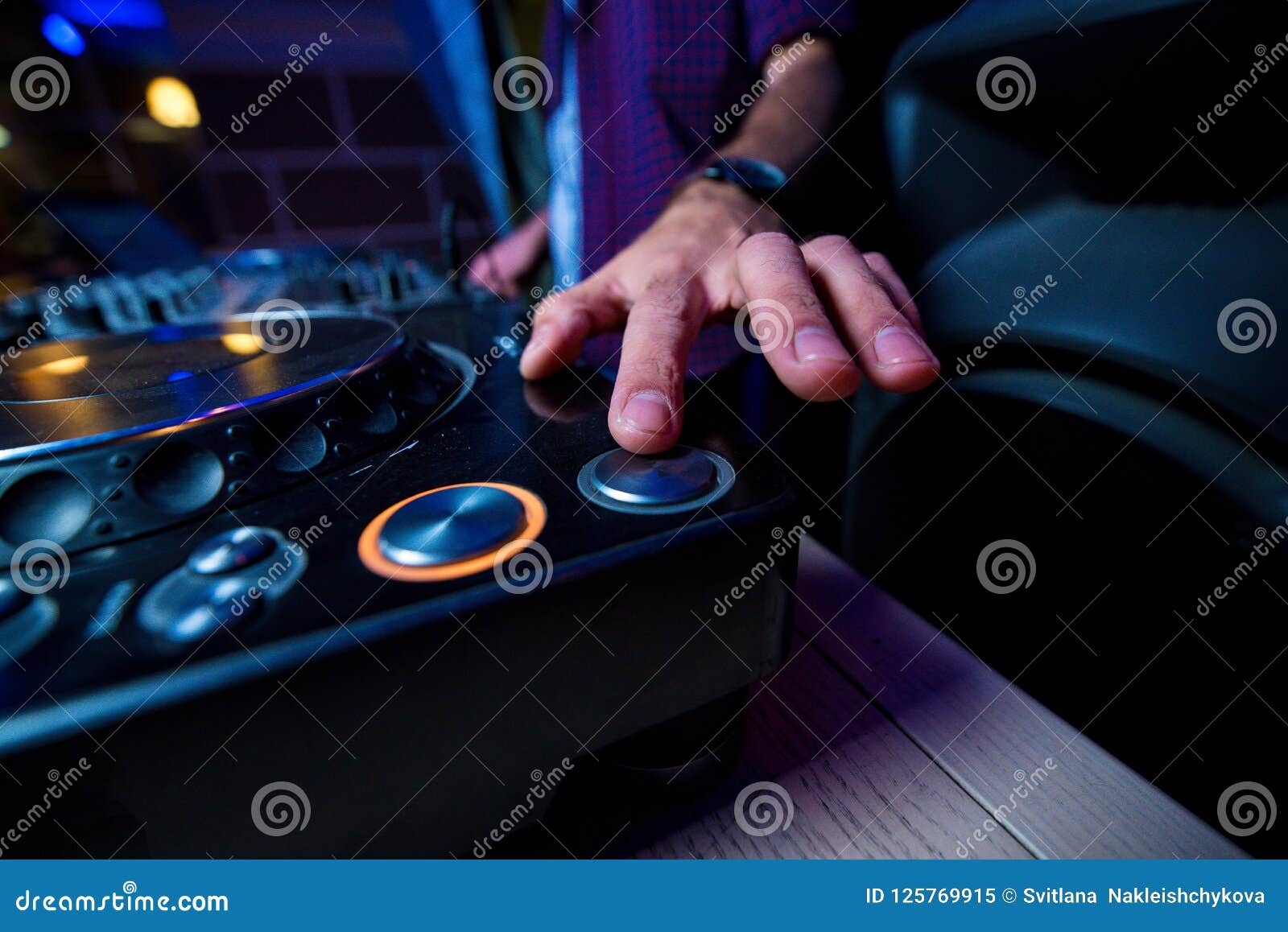 The Man`s Hand with the Clock Presses the Button of the DJ Keypa Stock ...