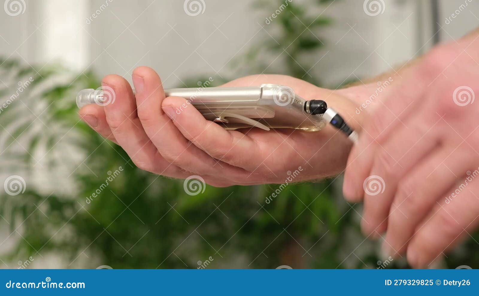 Man S Hand Connects Magnetic Cable for Charging Smartphone Stock Video ...