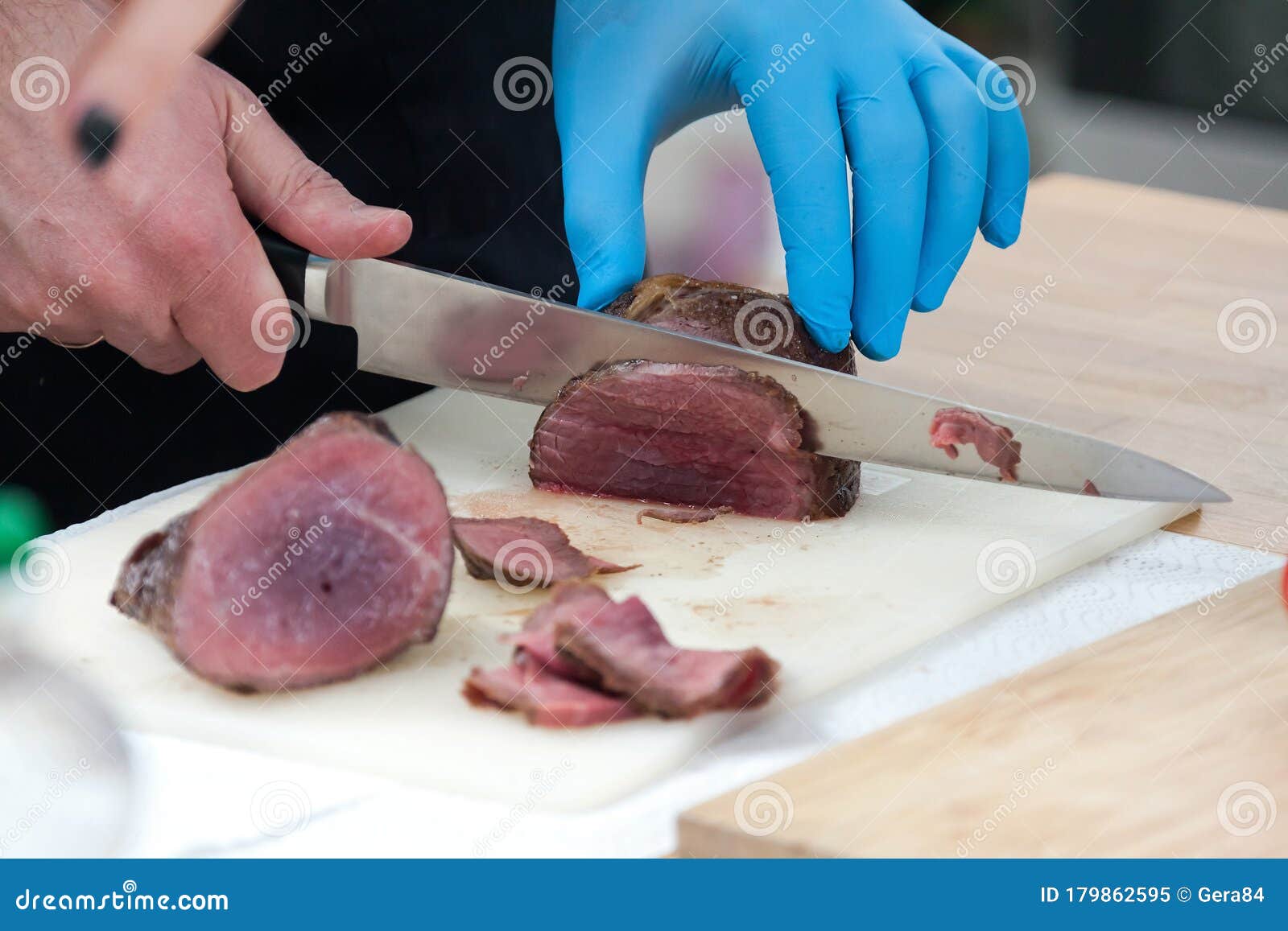 A Man`s Hand Cuts Cooked Meat Stock Image - Image of gilded, chop ...