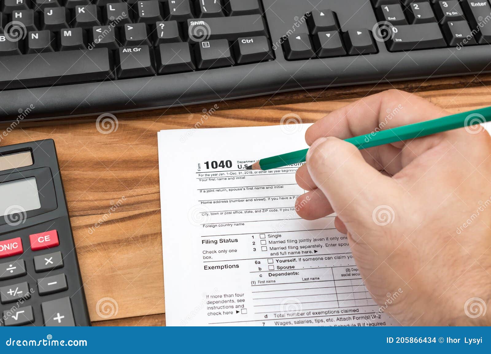Man`s Hand Filing Tax Form at the Workplace Editorial Stock Image ...