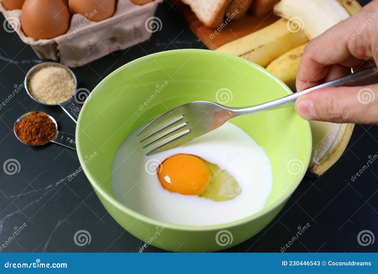 Man`s Hand with Fork Going To Mix Egg and Milk in the Mixing Bowl Stock ...