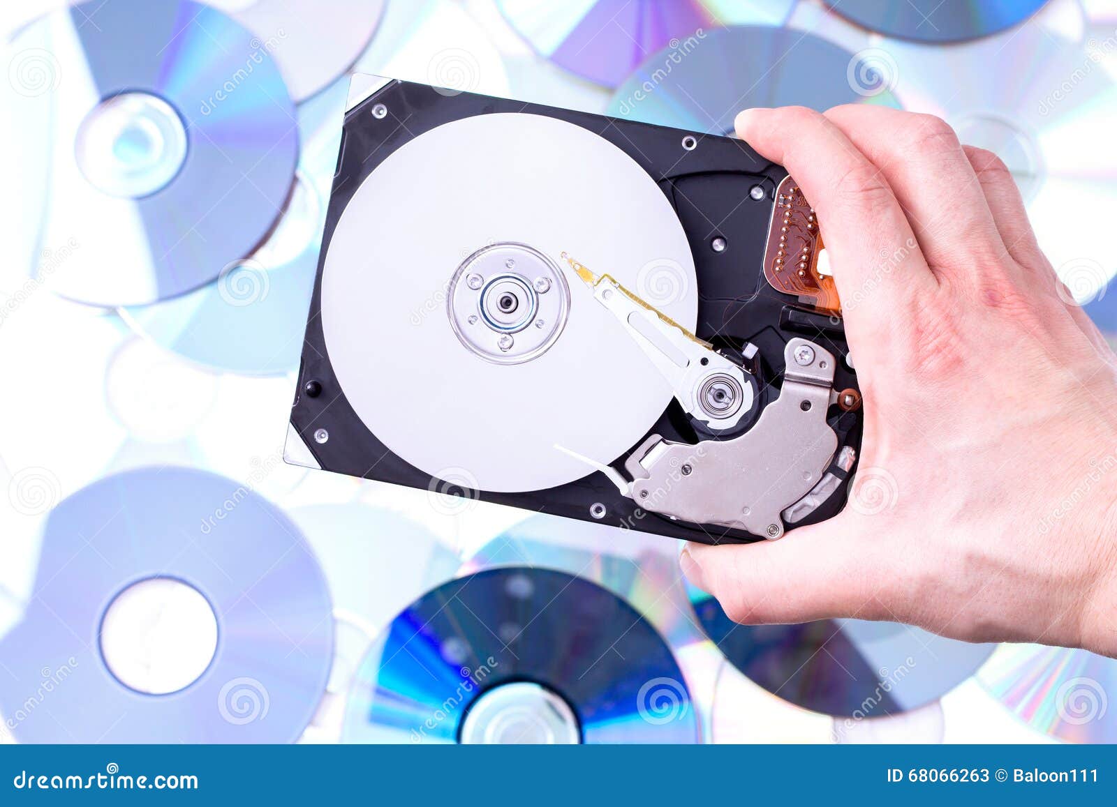 Man S Hand with Hard Disk Drive Over CD S Background. Stock Image ...