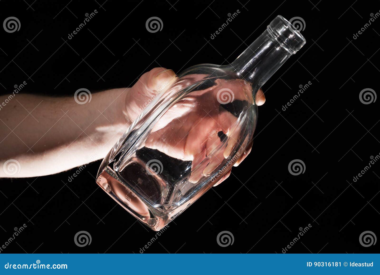 Man`s Hand Holding Empty Bottle of Alcohol Stock Image - Image of ...