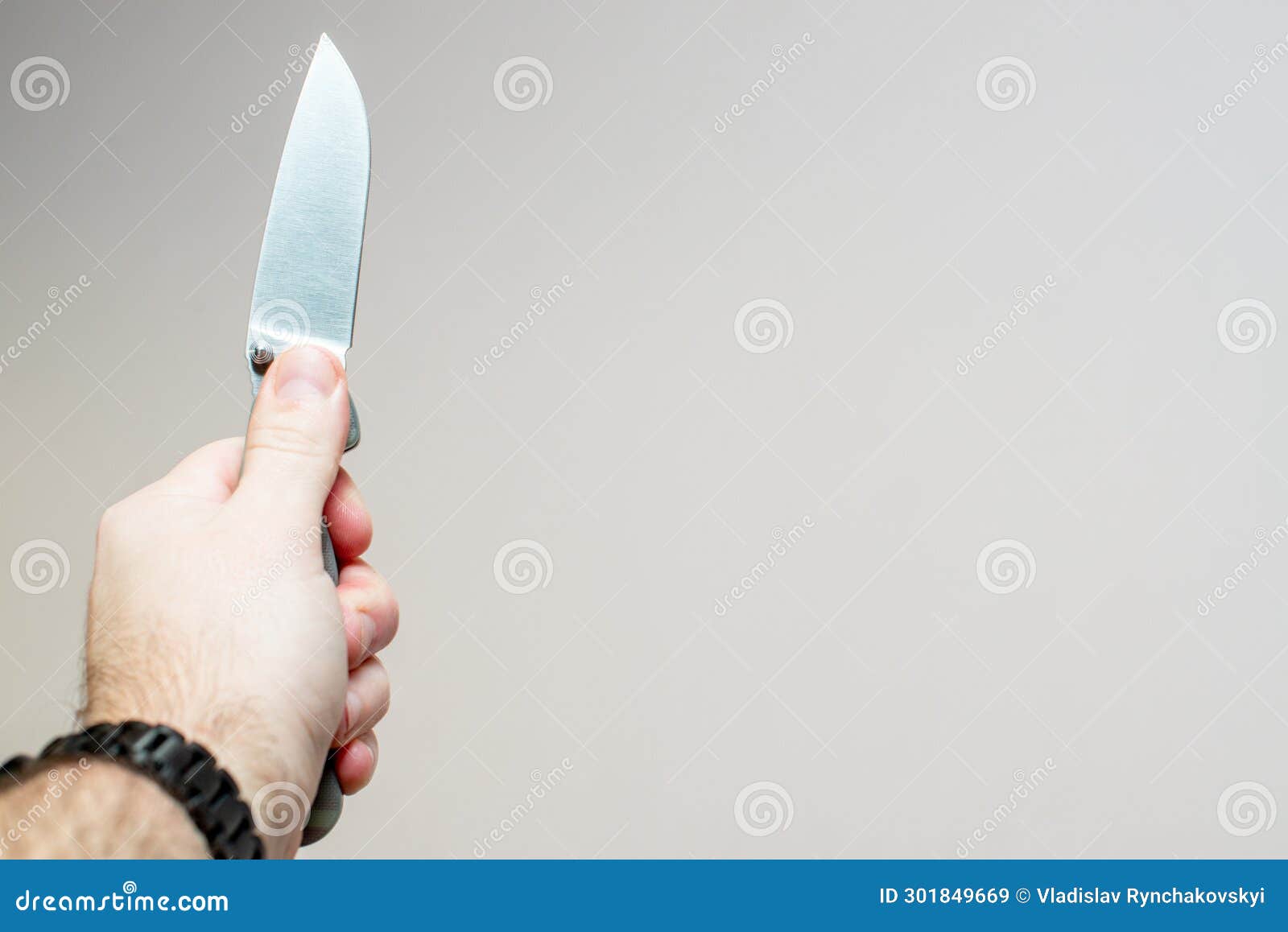 Man S Hand Holding a Folding Knife Stock Image - Image of curved, short ...