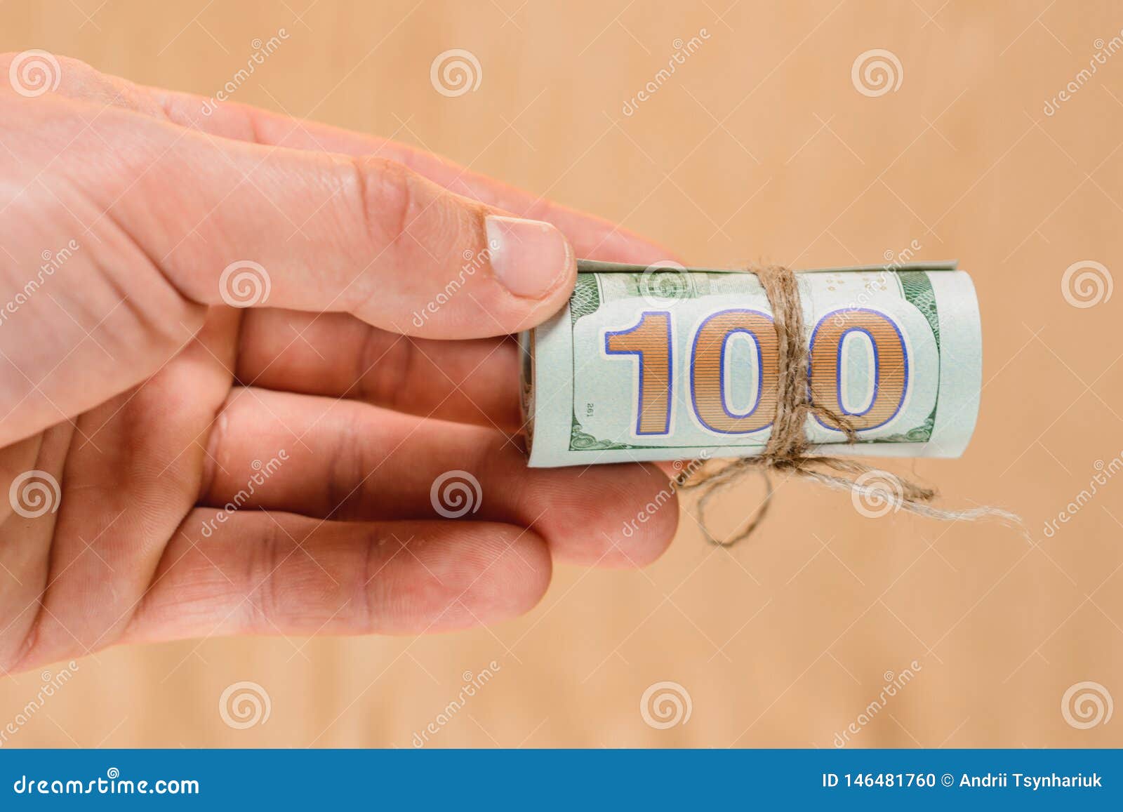 A Man`s Hand Holding 100 Hundred Banknotes, a Transfer of Money Stock ...