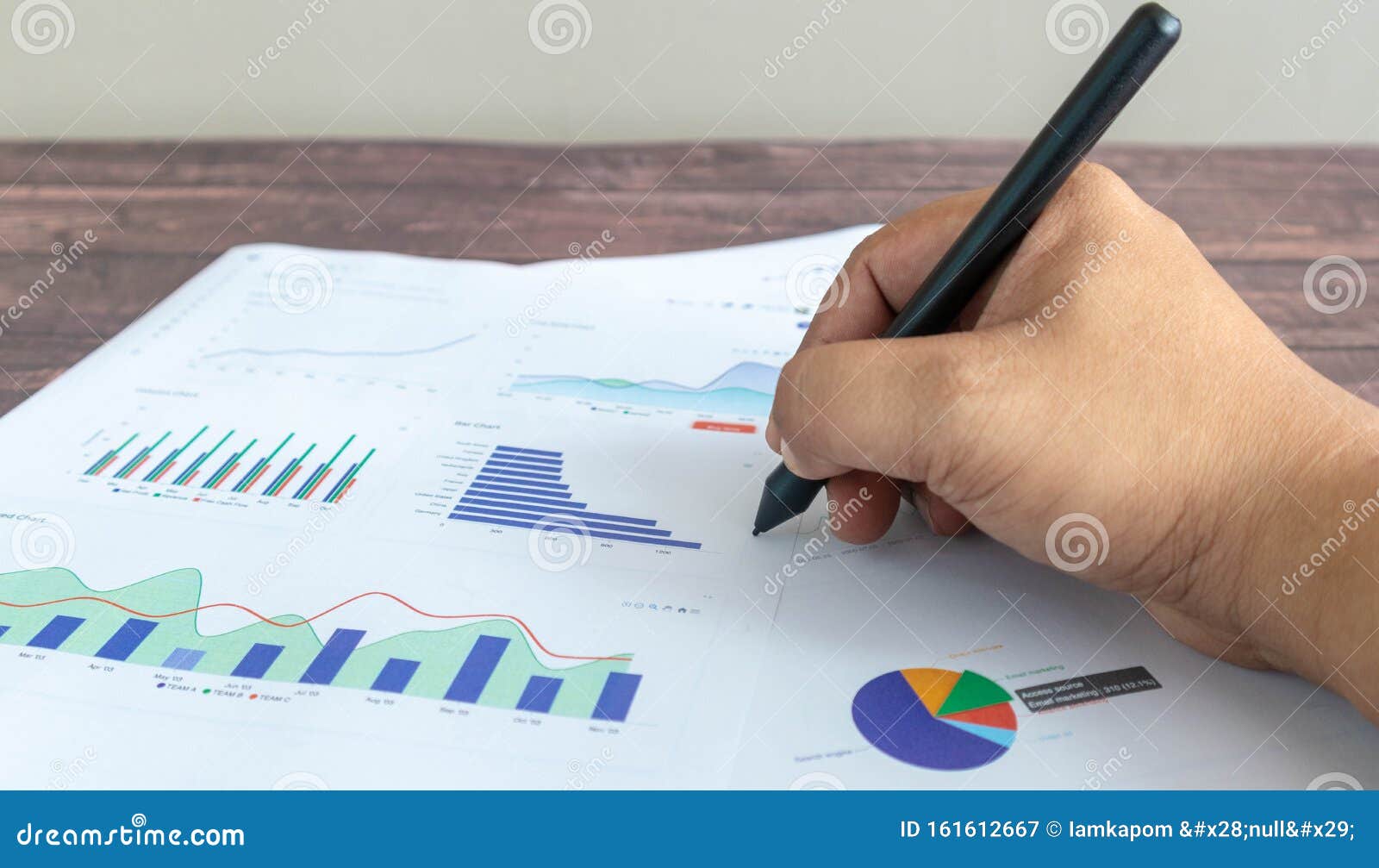 A Man`s Hand Holding a Pen is about To Write Something on the Line ...