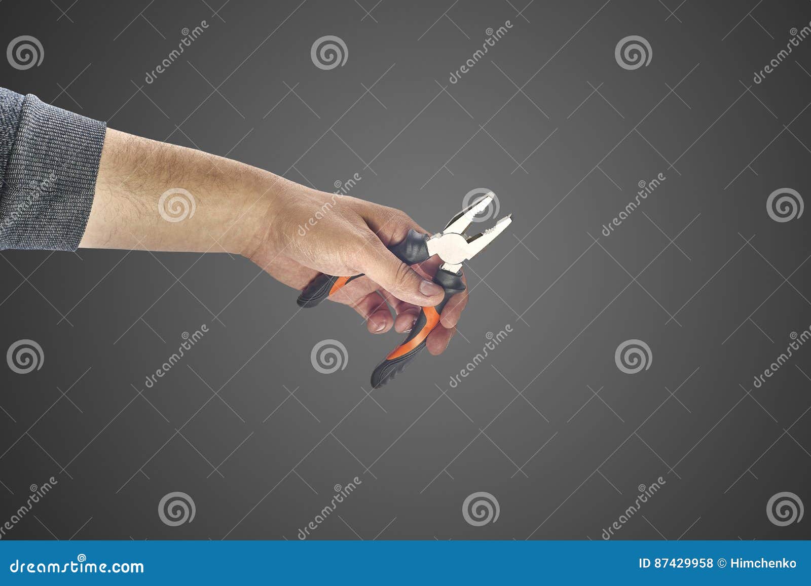 Man`s Hand Holding a Pliers Stock Photo - Image of white, metal: 87429958