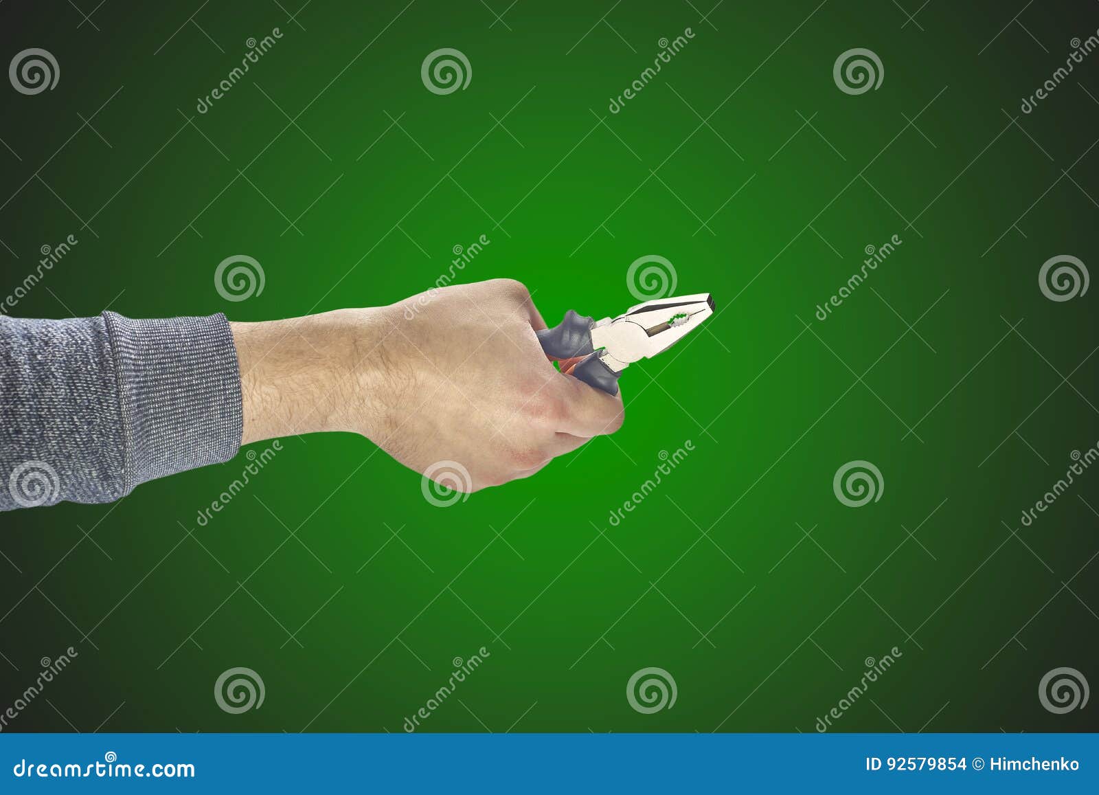 Man`s Hand Holding a Pliers Stock Photo - Image of twist, power: 92579854
