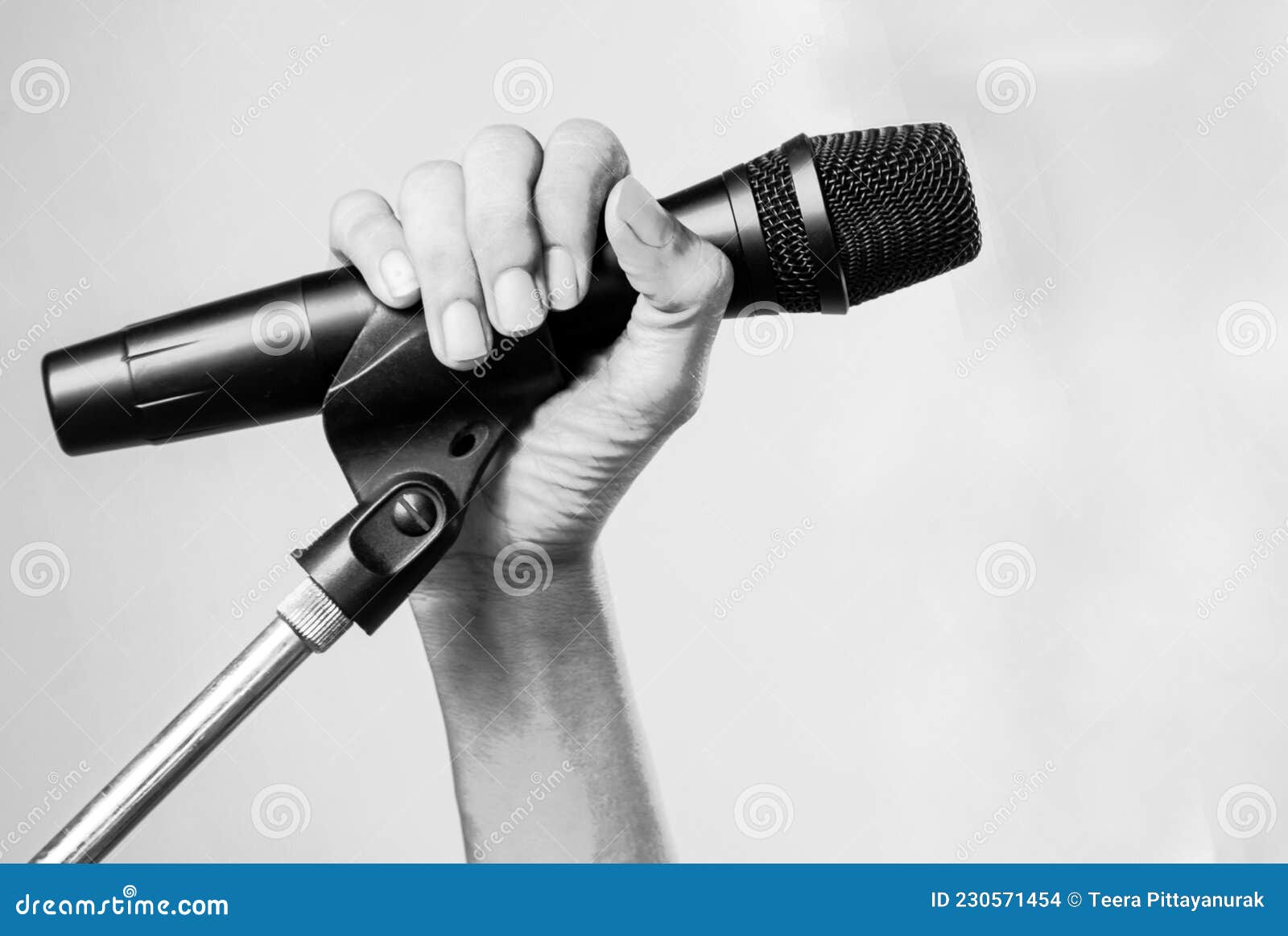 Man`s Hand Holding a Wireless Microphone on a Stand Stock Photo - Image ...