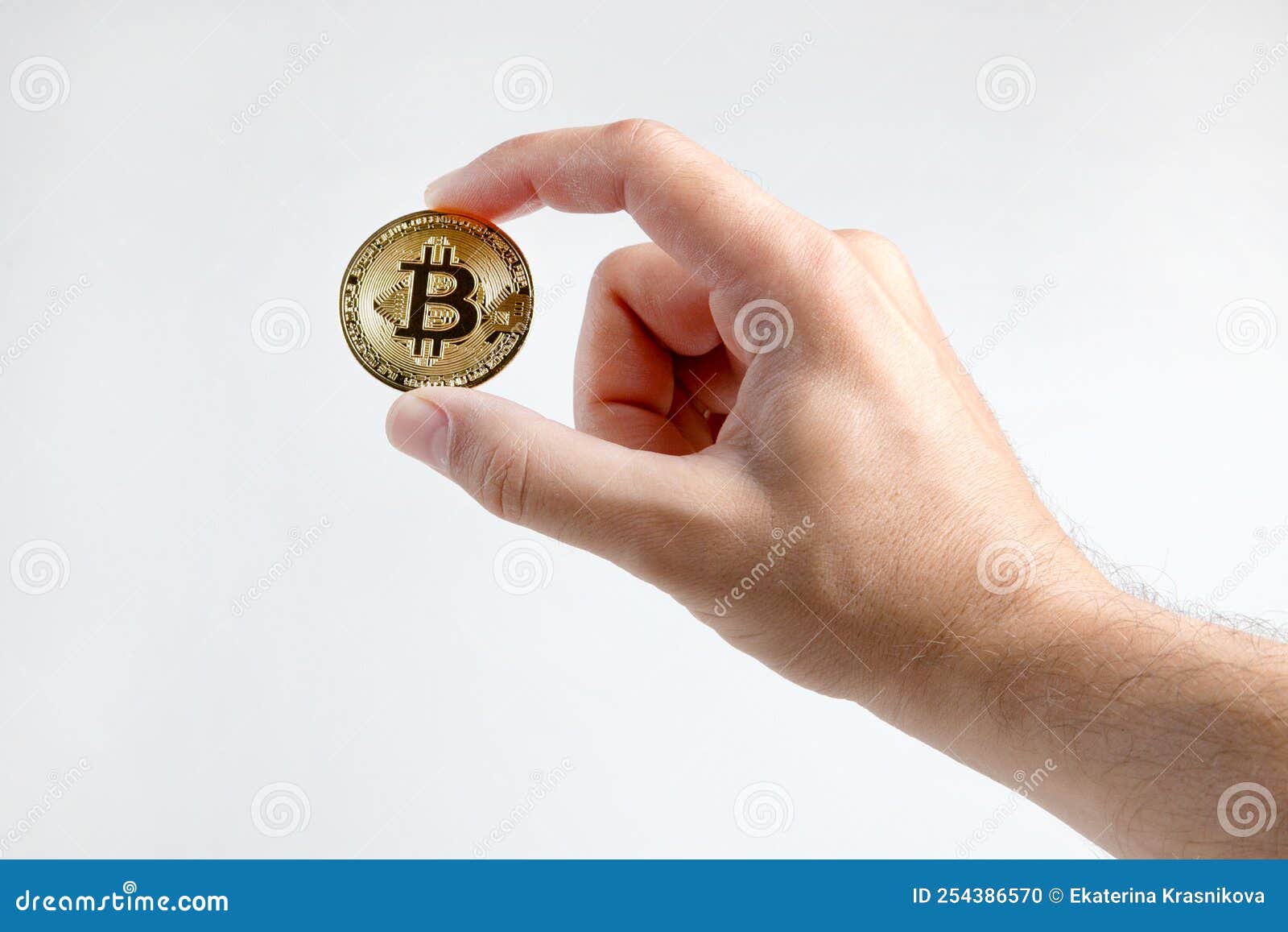 A Man`s Hand Holds a Gold Bitcoin, Isolated on a White Background Stock ...