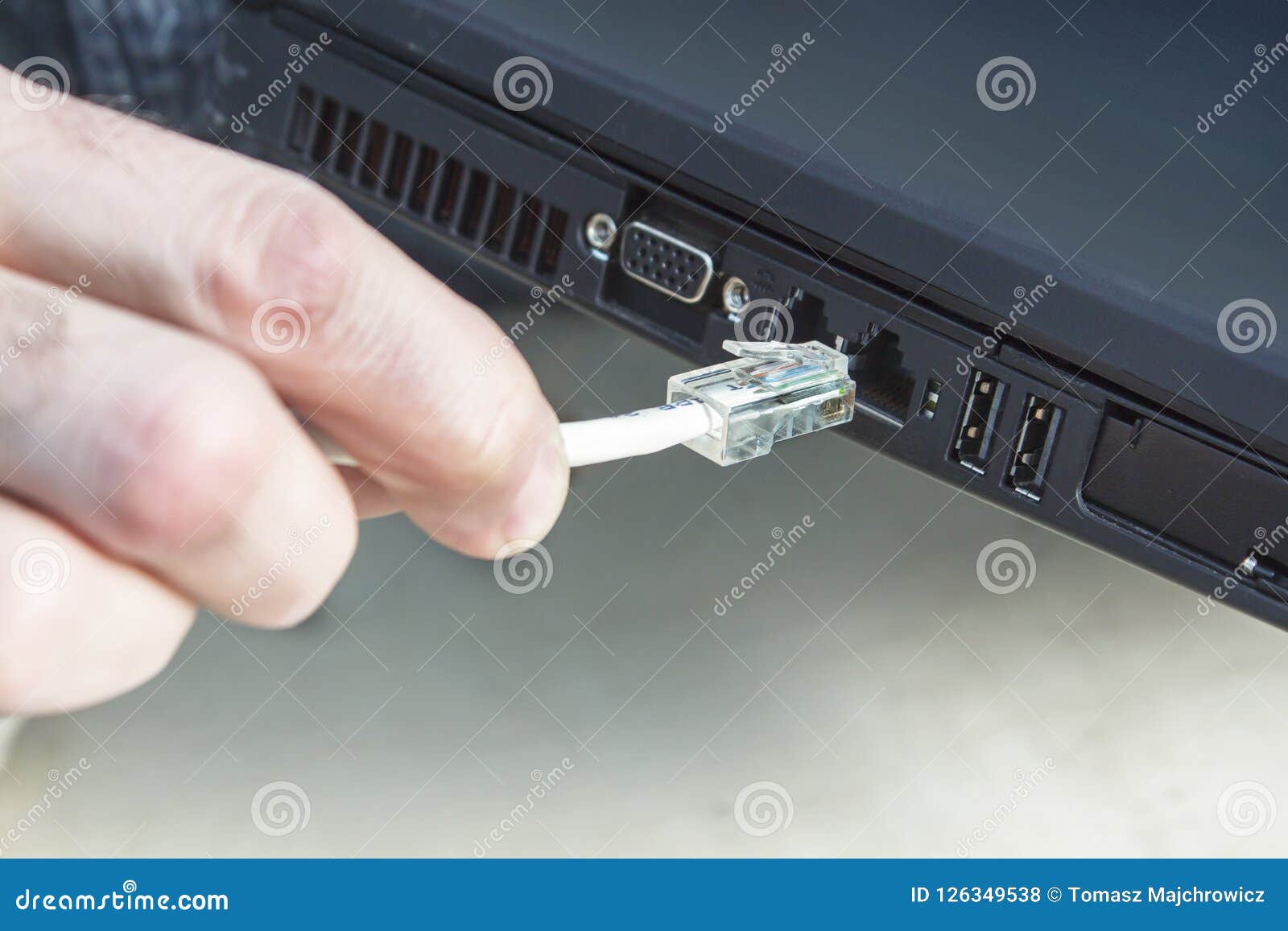 The Man`s Hand Inserts an RJ45 Ethernet Plug into the Internet Stock ...