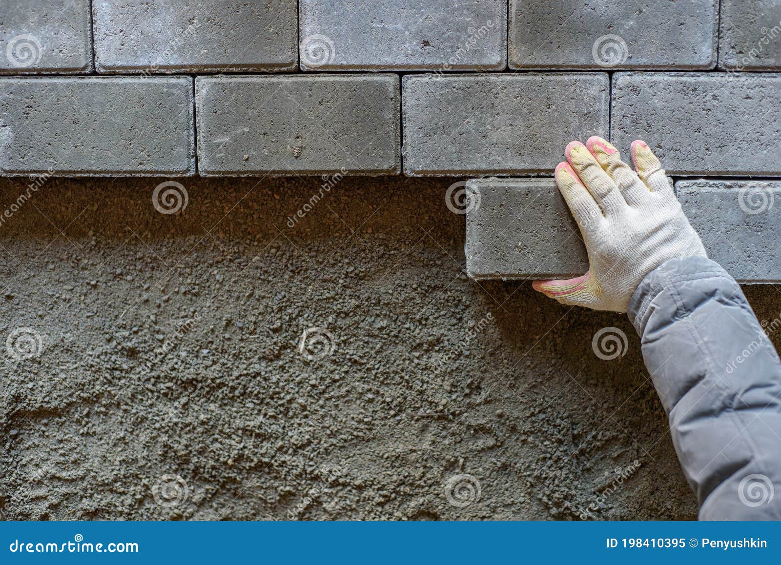 A Man`s Hand is Laying the Paving Stones. Stock Image - Image of ...