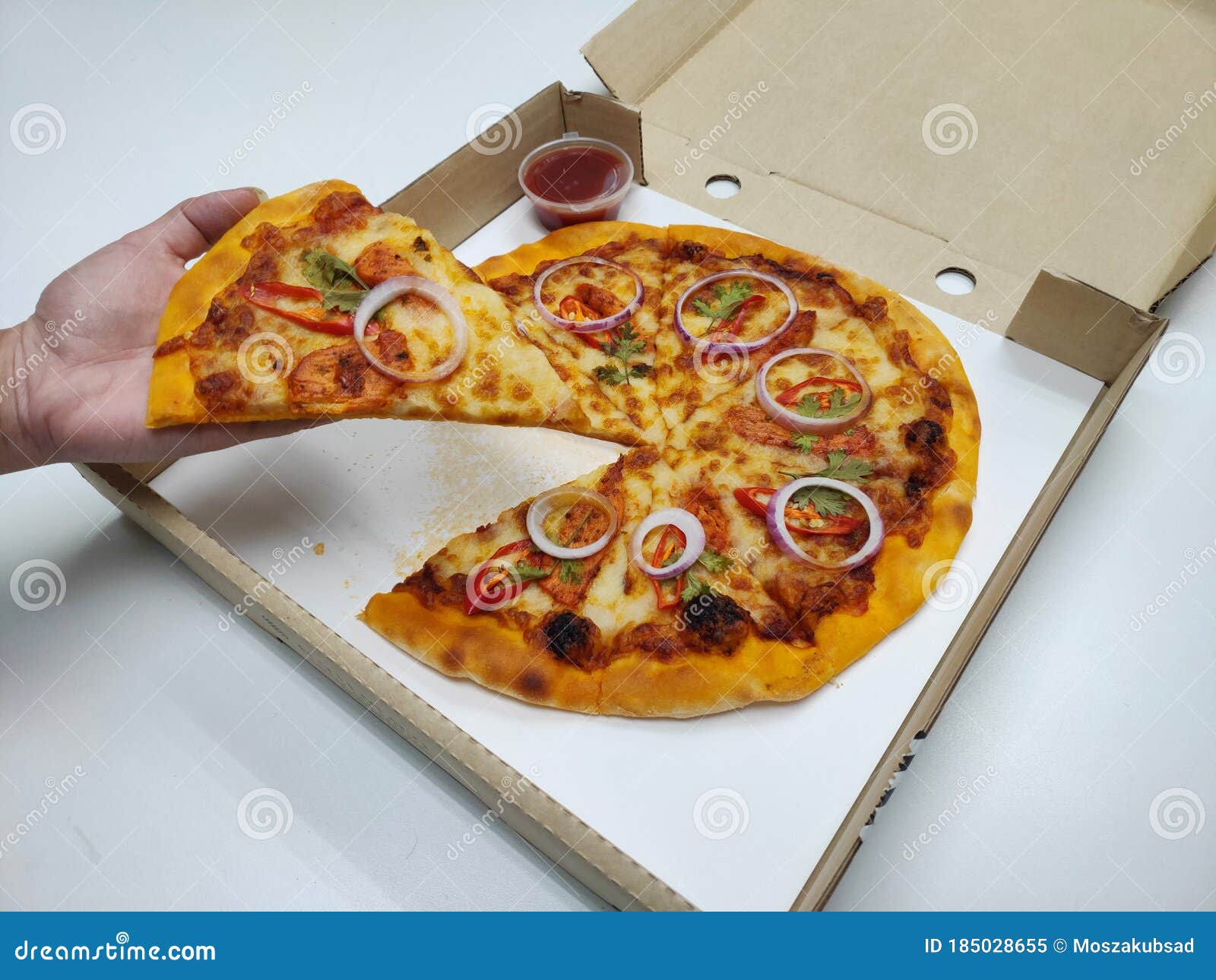 A Man`s Hand is Picking a Pizza from the Pizza Tray Stock Image - Image ...
