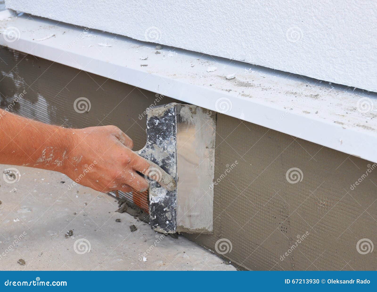 Man S Hand Plastering a Wall Insulation and House Foundation with ...