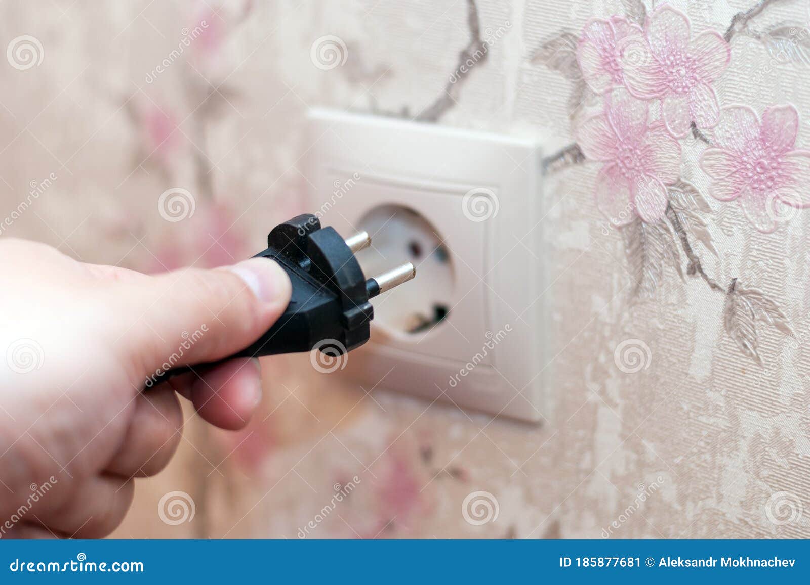 A Man Hand Plugs the Cord into a Power Outlet Stock Image - Image of ...