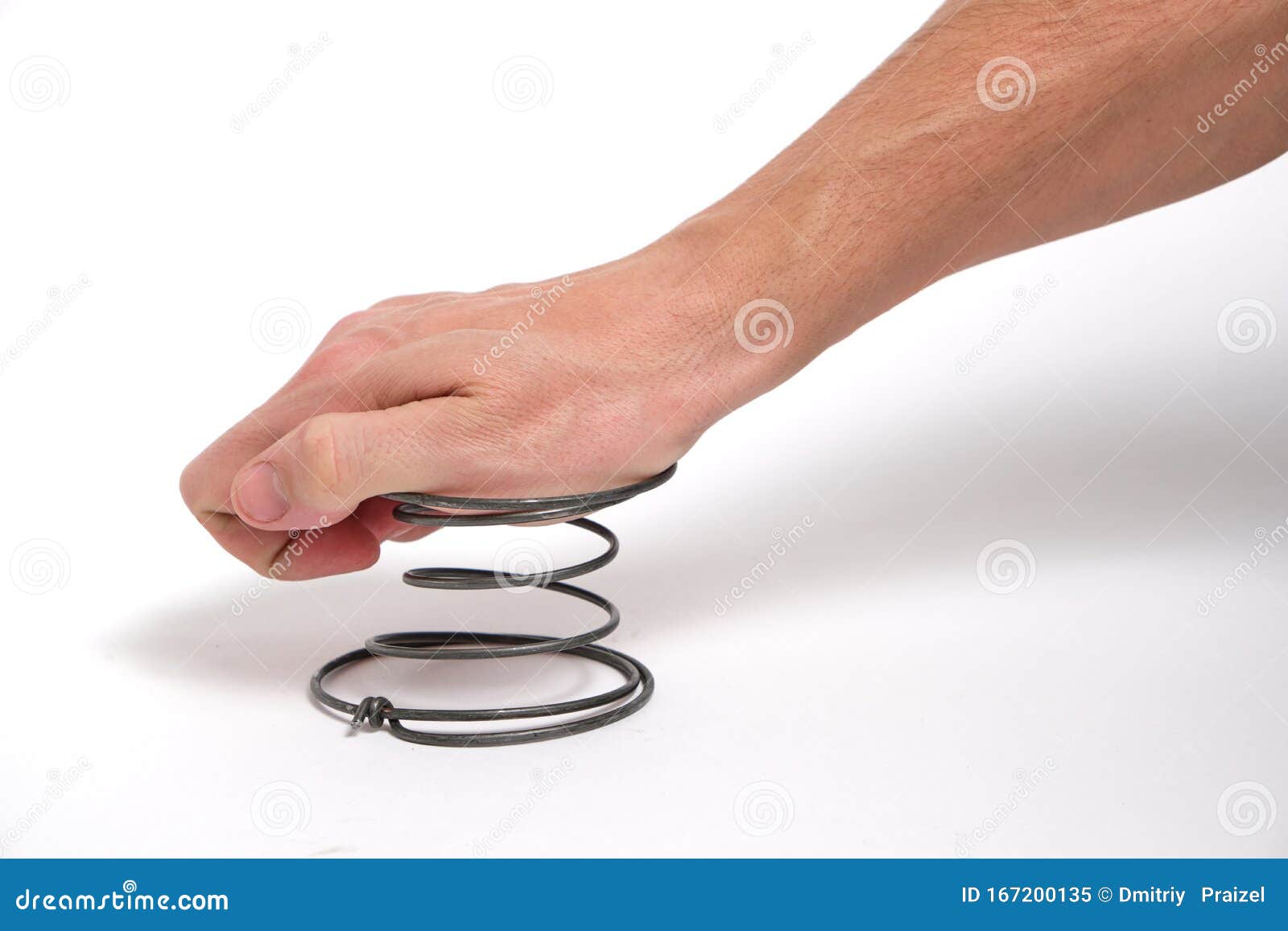 A Man`s Hand Presses on a Spring, on a White Background.Exert Pressure ...