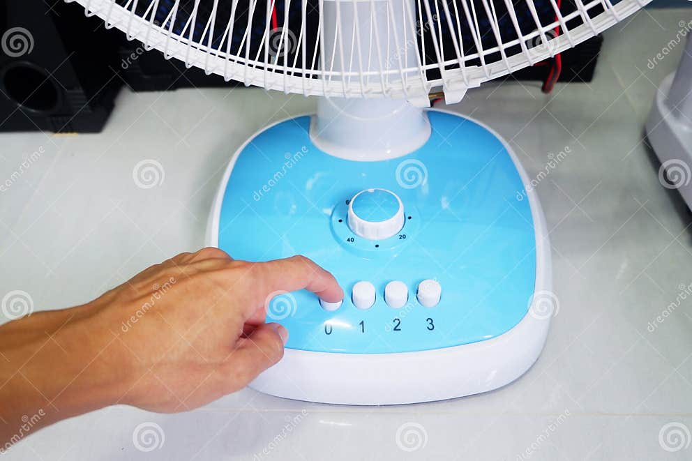 Man S Hand Pressing a Fan Button and Turning the Timer Stock Image ...