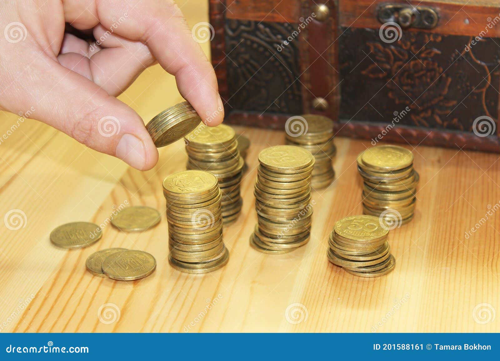 A Man`s Hand Puts Coins in a Stack Stock Image - Image of currency ...
