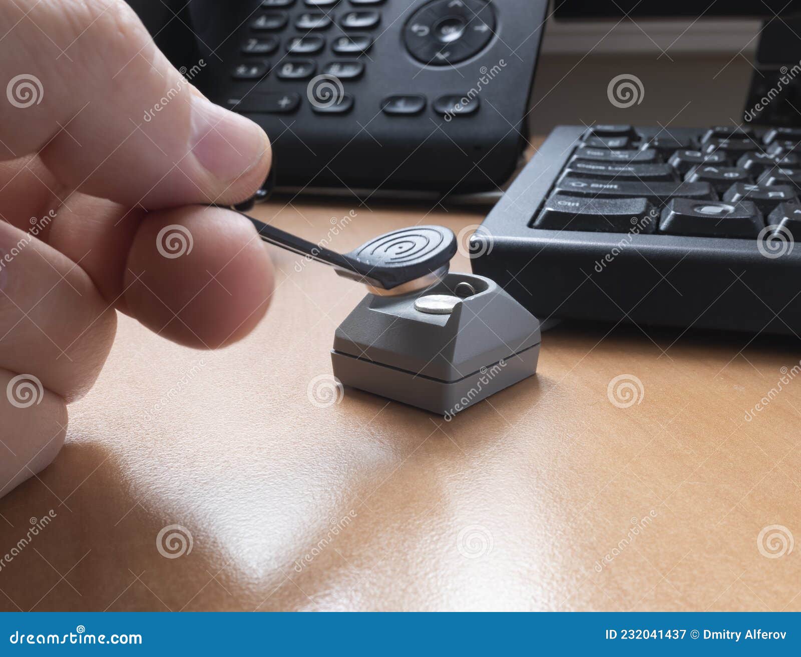 A Man S Hand Puts a Touch Memory Key on the Reader To Access the ...