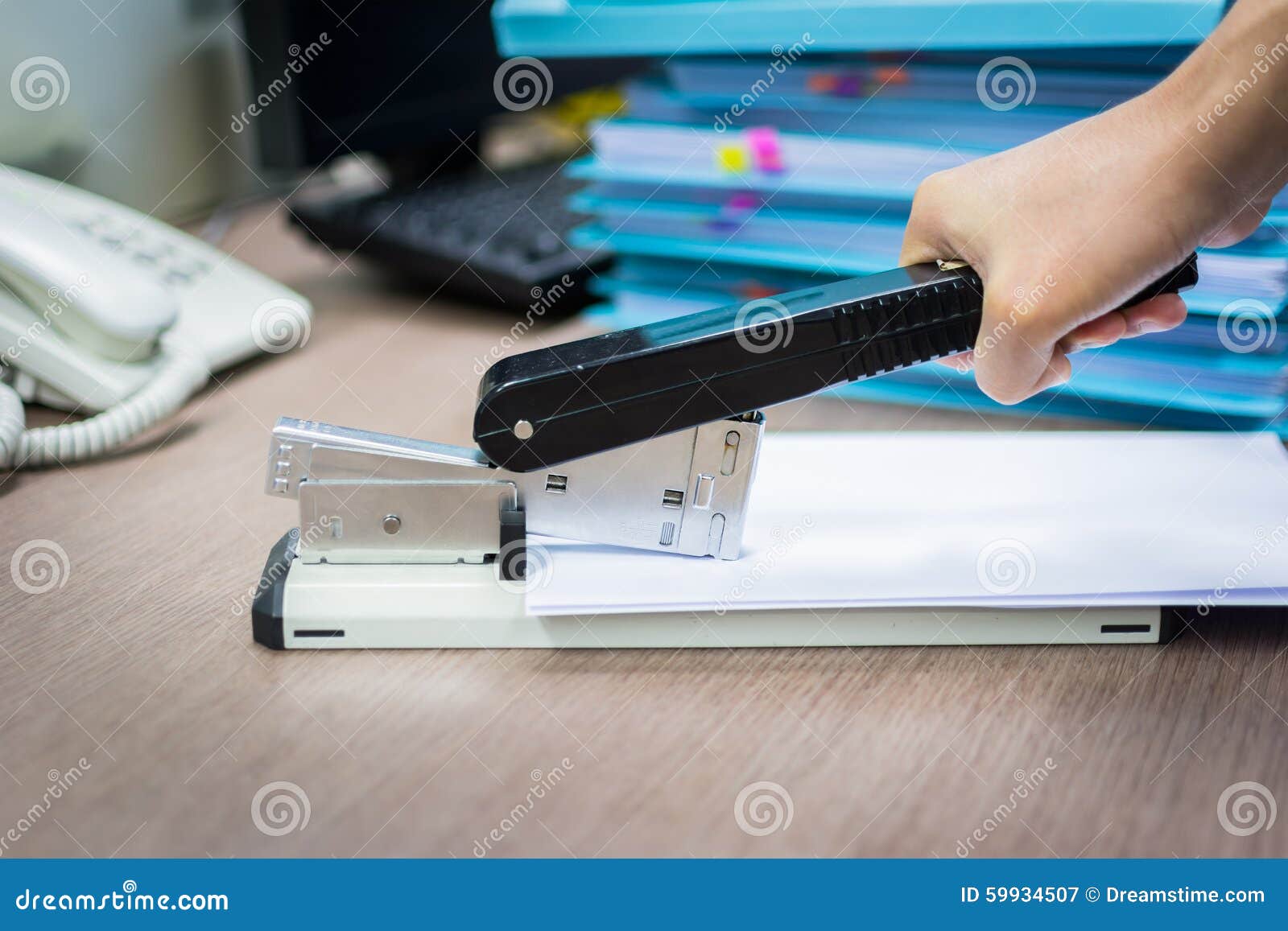 Man s hand stapling paper stock image. Image of table - 59934507
