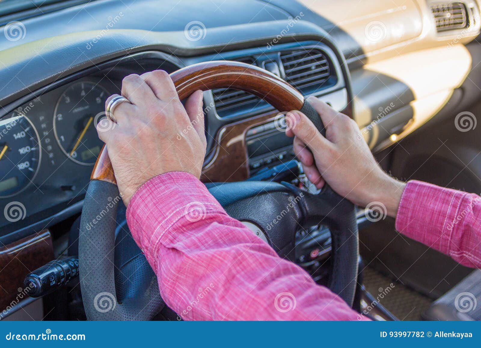 Man`s Hand on the Steering Wheel Inside of a Car Stock Photo - Image of ...