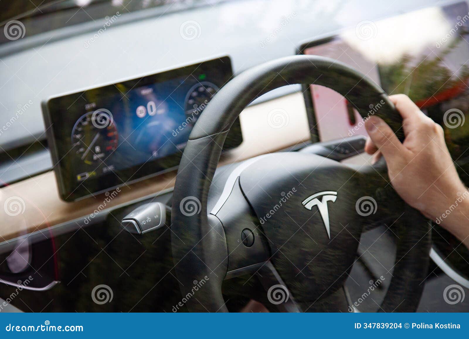 Man S Hand on the Tesla S Steering Wheel Editorial Stock Image - Image ...
