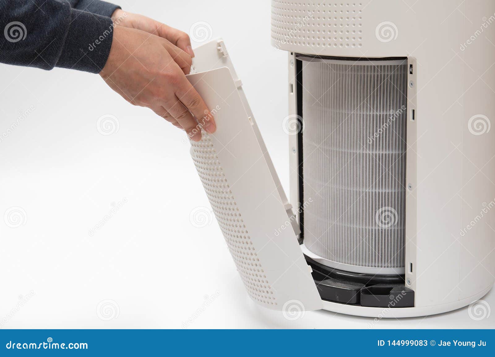 A Man`s Hand Turning an Air Purifier`s Filter into a New One. Stock ...