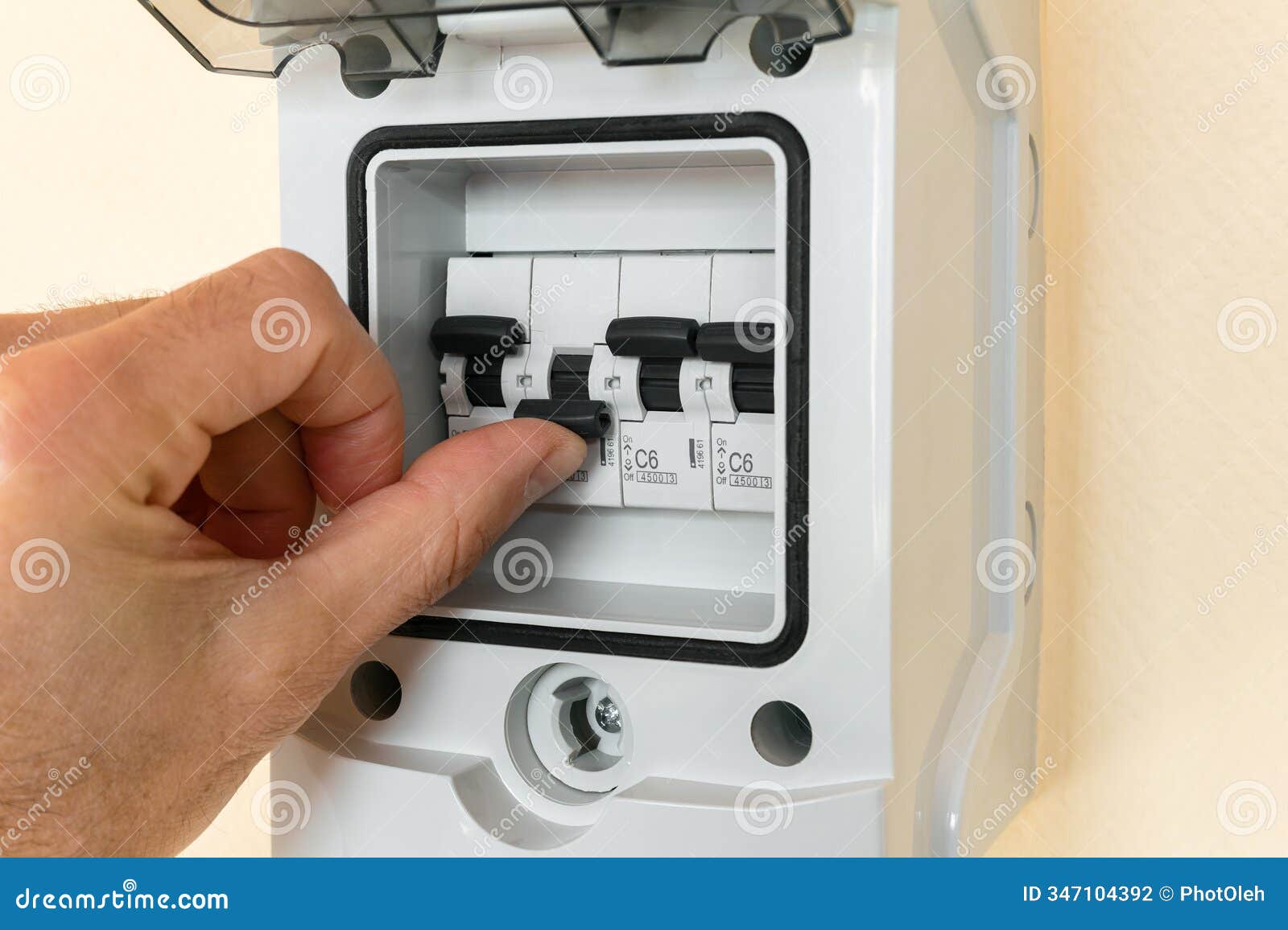 A Man S Hand Turns on a Disabled Electrical Circuit Breaker Stock Photo ...